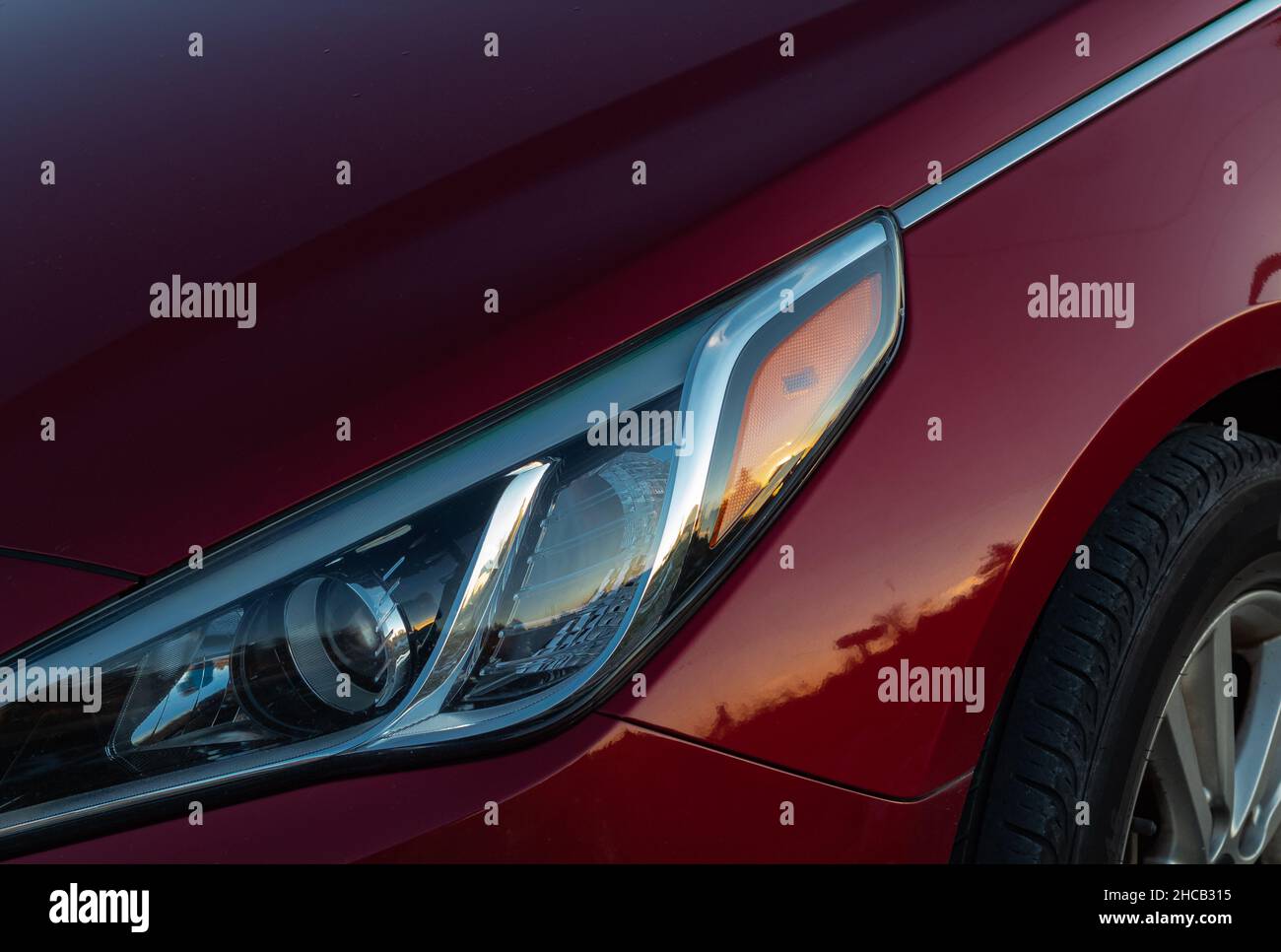Close-up view of red sports car headlight Stock Photo - Alamy