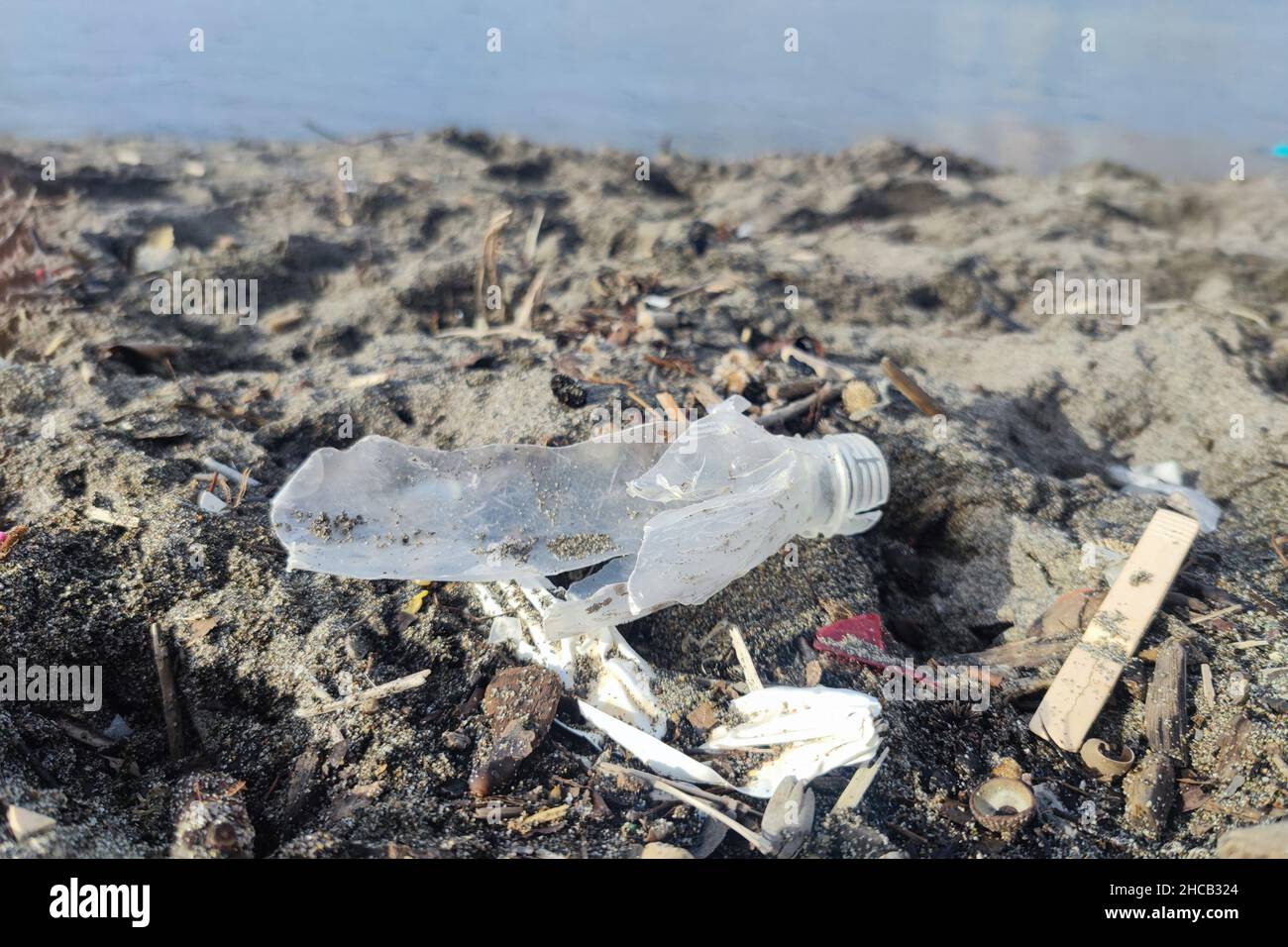 Plastic waste rubbish garbage on the sandy beach Stock Photo - Alamy