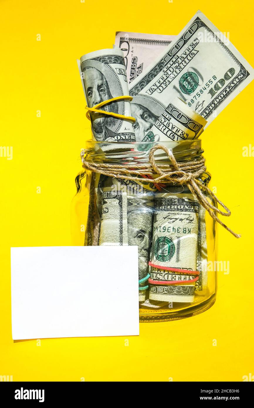 Glass jars filled with Dollar bills, savings inside glass jar, money ...