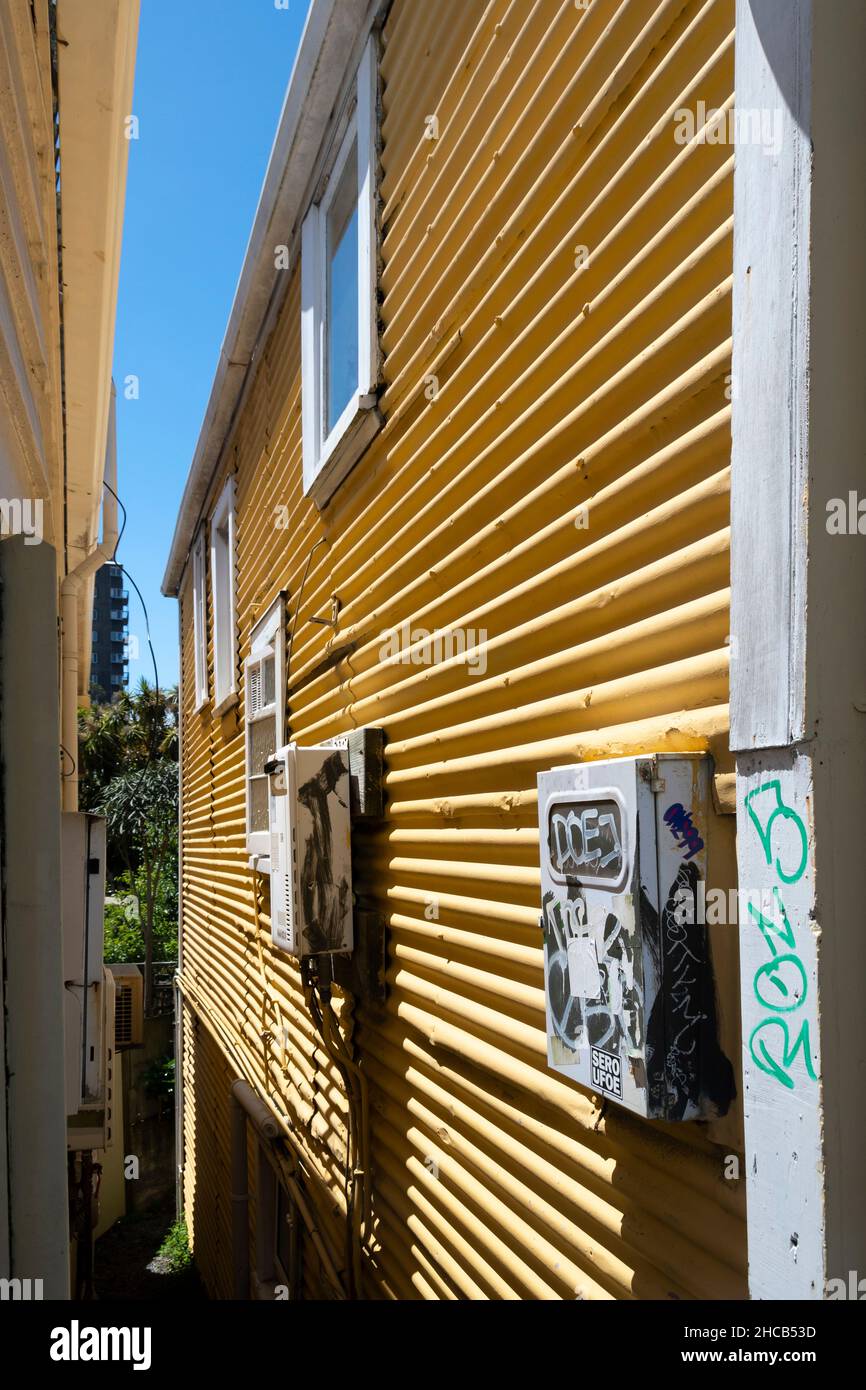 Yellow house clad with corrugated iron, Aro Street, Wellington, North ...