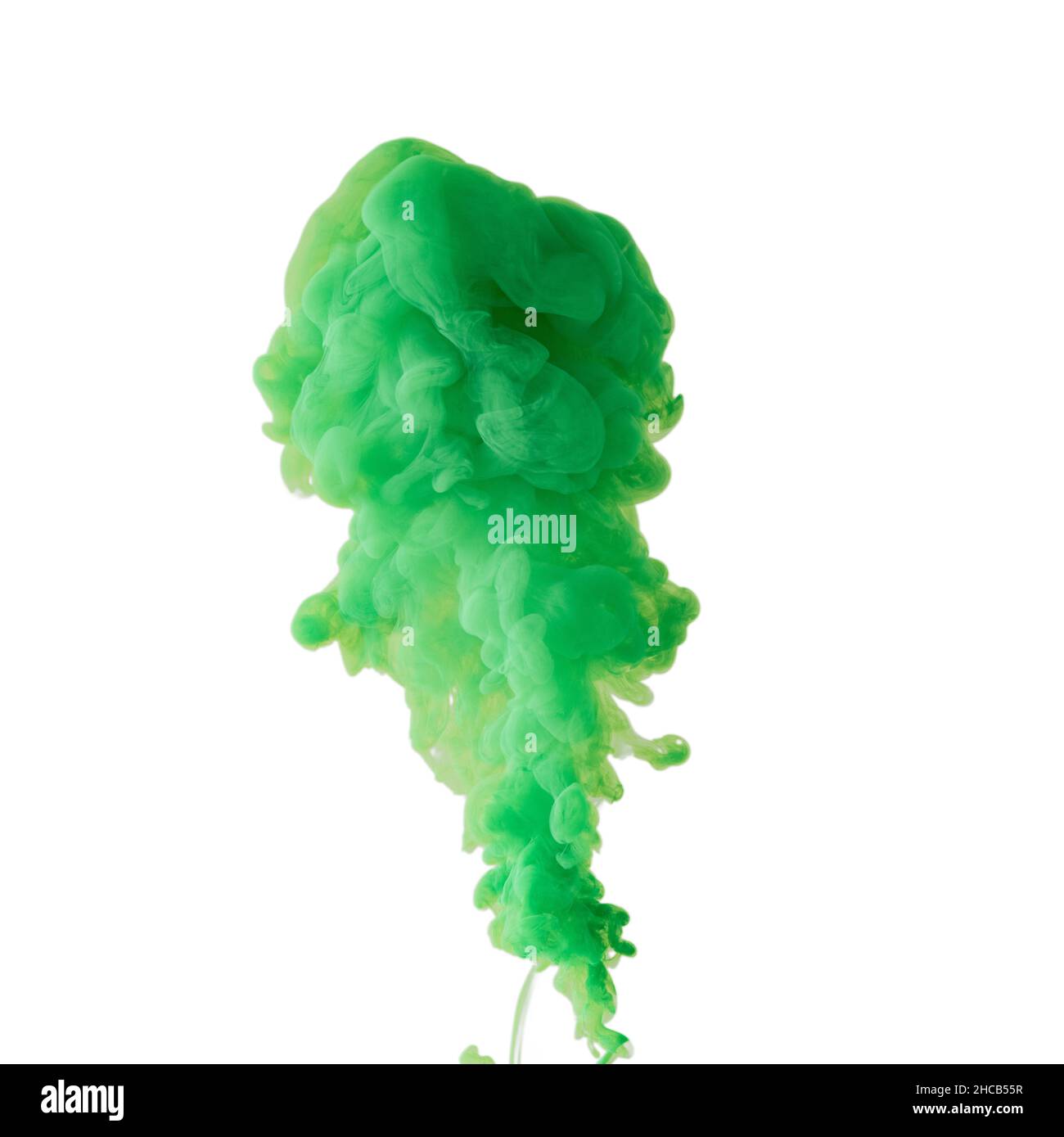 Light green. Explosion of colored, fluid and neoned liquids on white ...
