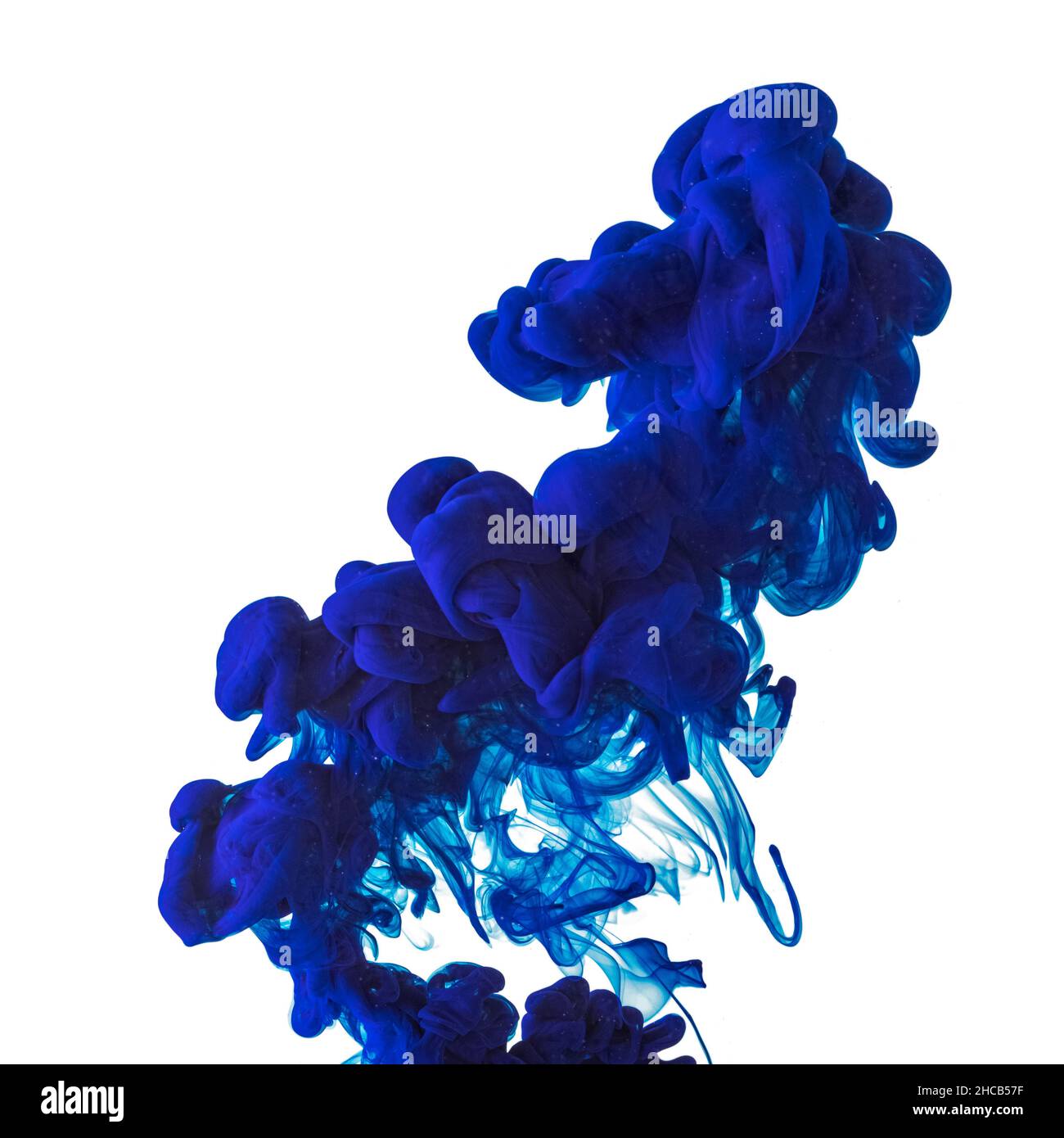 Explosion of colored, fluid and neoned liquids on white studio ...