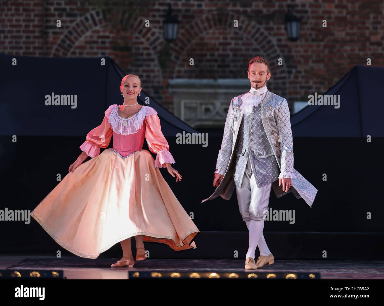 Krakow, Poland - July 25, 2021: Artists in costumes performing on stage ...