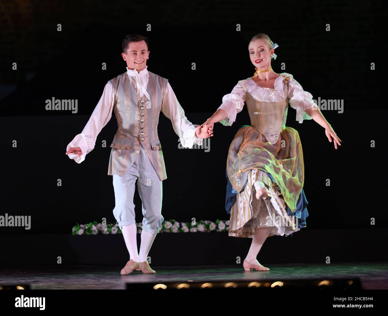 Krakow, Poland - July 25, 2021: Artists in costumes performing on stage ...