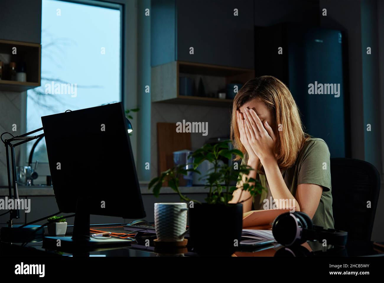 Woman works late at home workplace, remote work concept. Burnout and ...