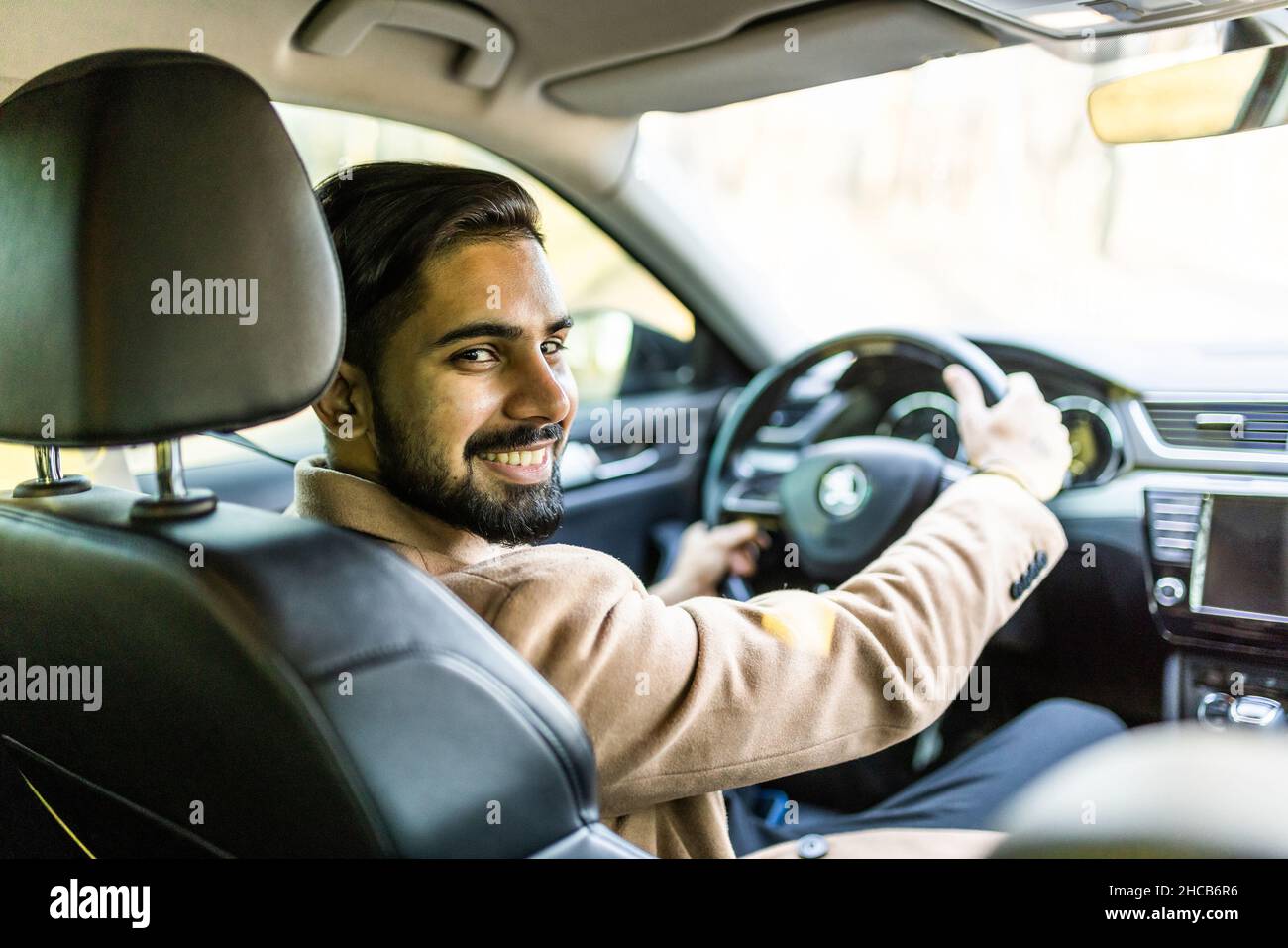 Young handsome asian man driving car to travel Stock Photo - Alamy