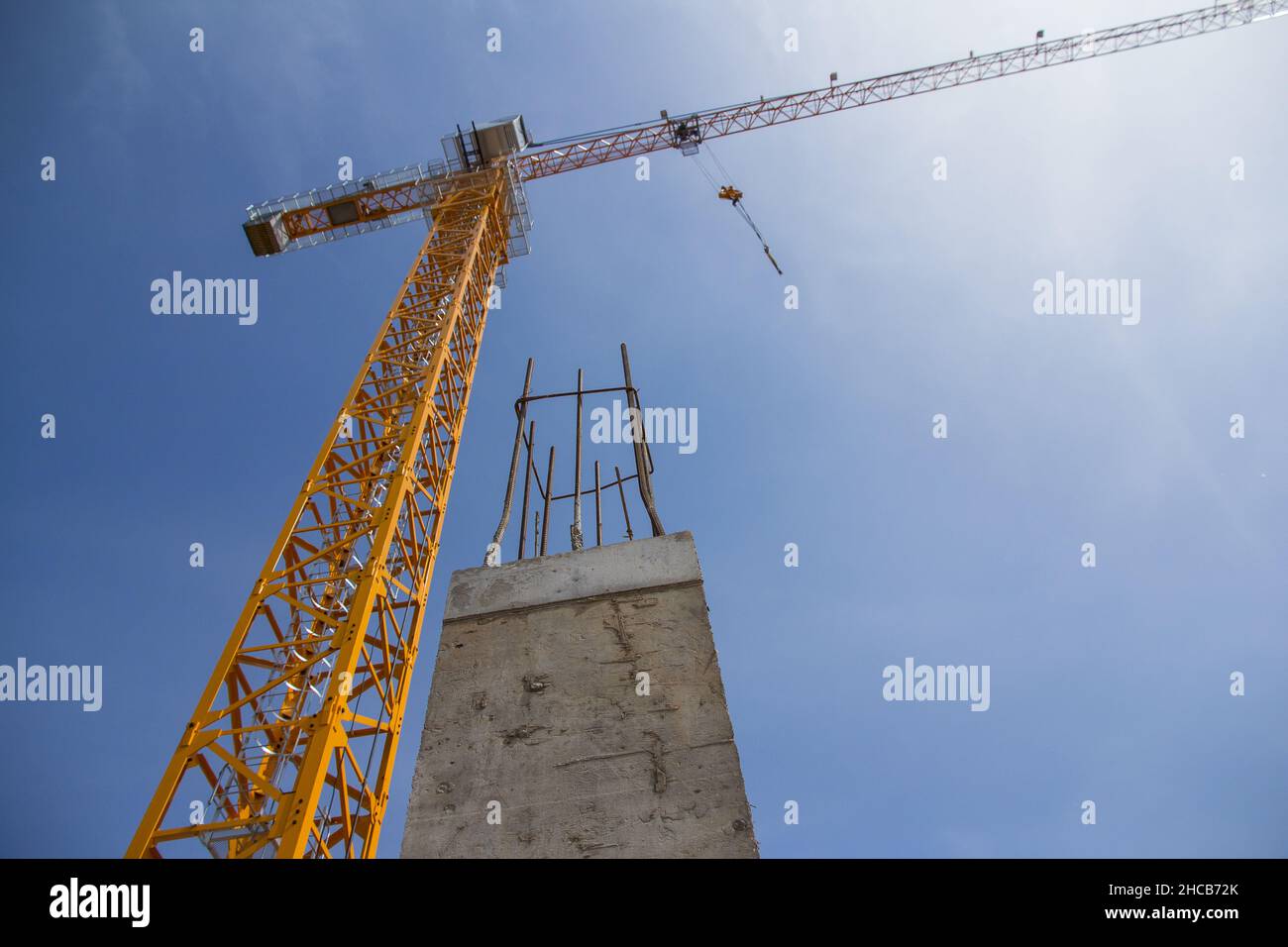 Tower crane and concrete base of the building. Construction crane on ...