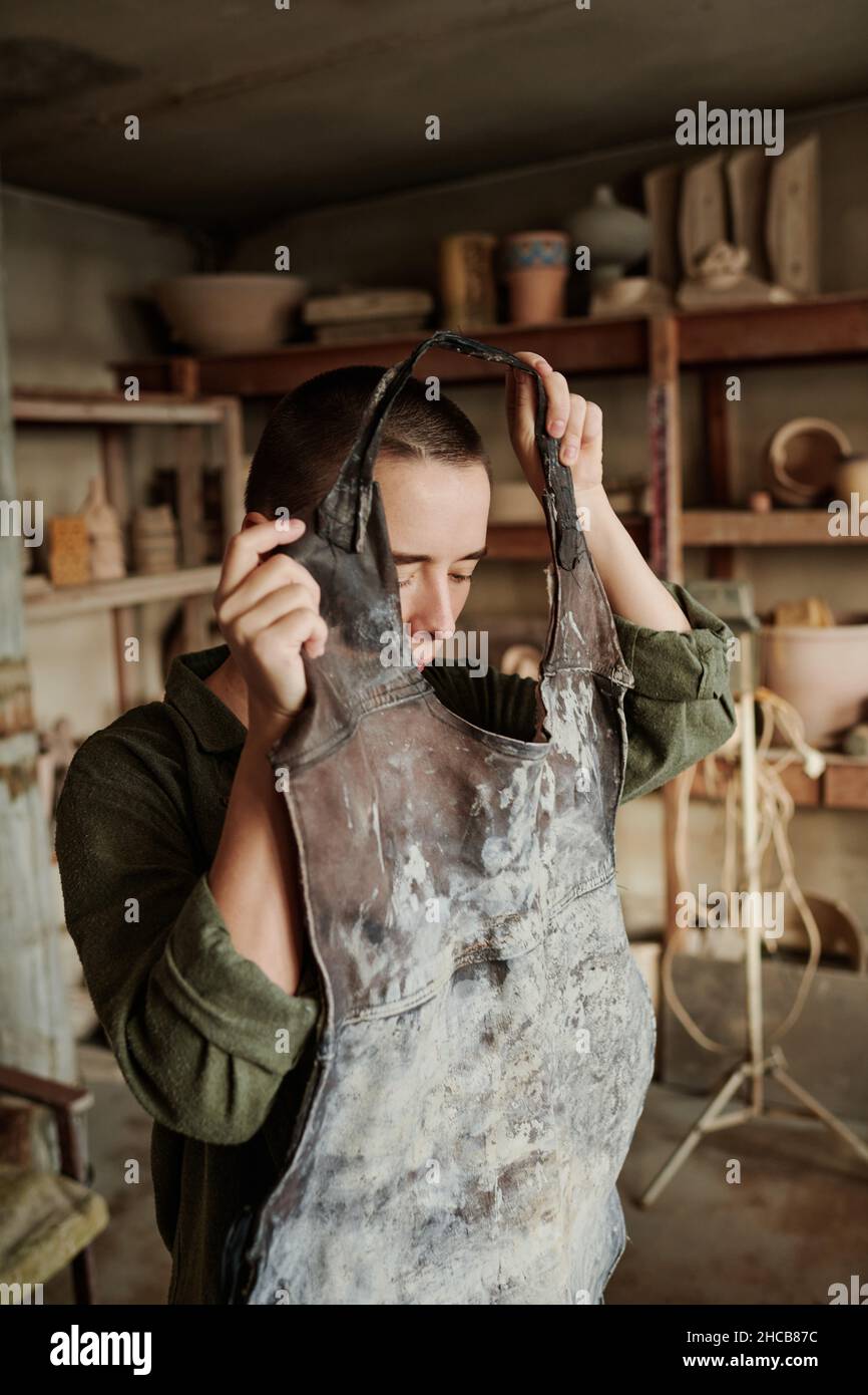Woman potter wearing apron preparing hi-res stock photography and ...