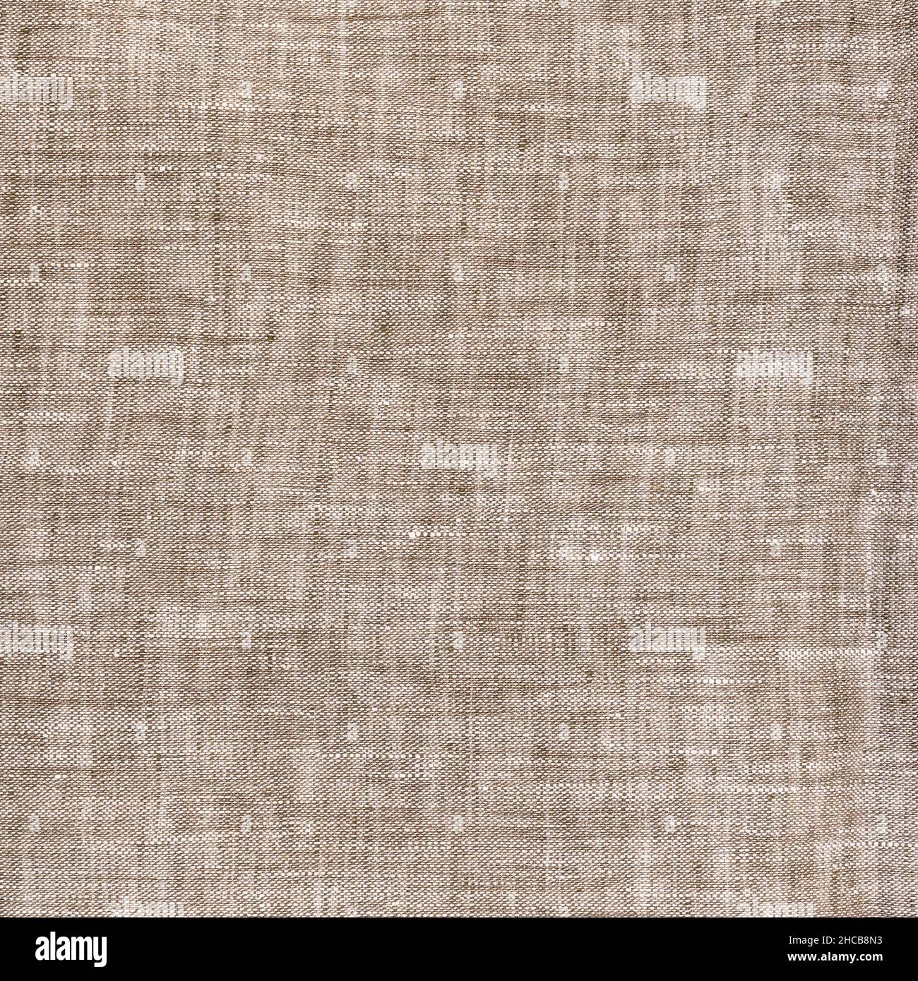square textile background from brown linen fabric close up Stock Photo ...