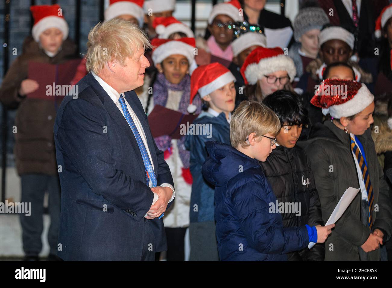 Prime Minister Boris Johnson listens to a children's choir at a ...