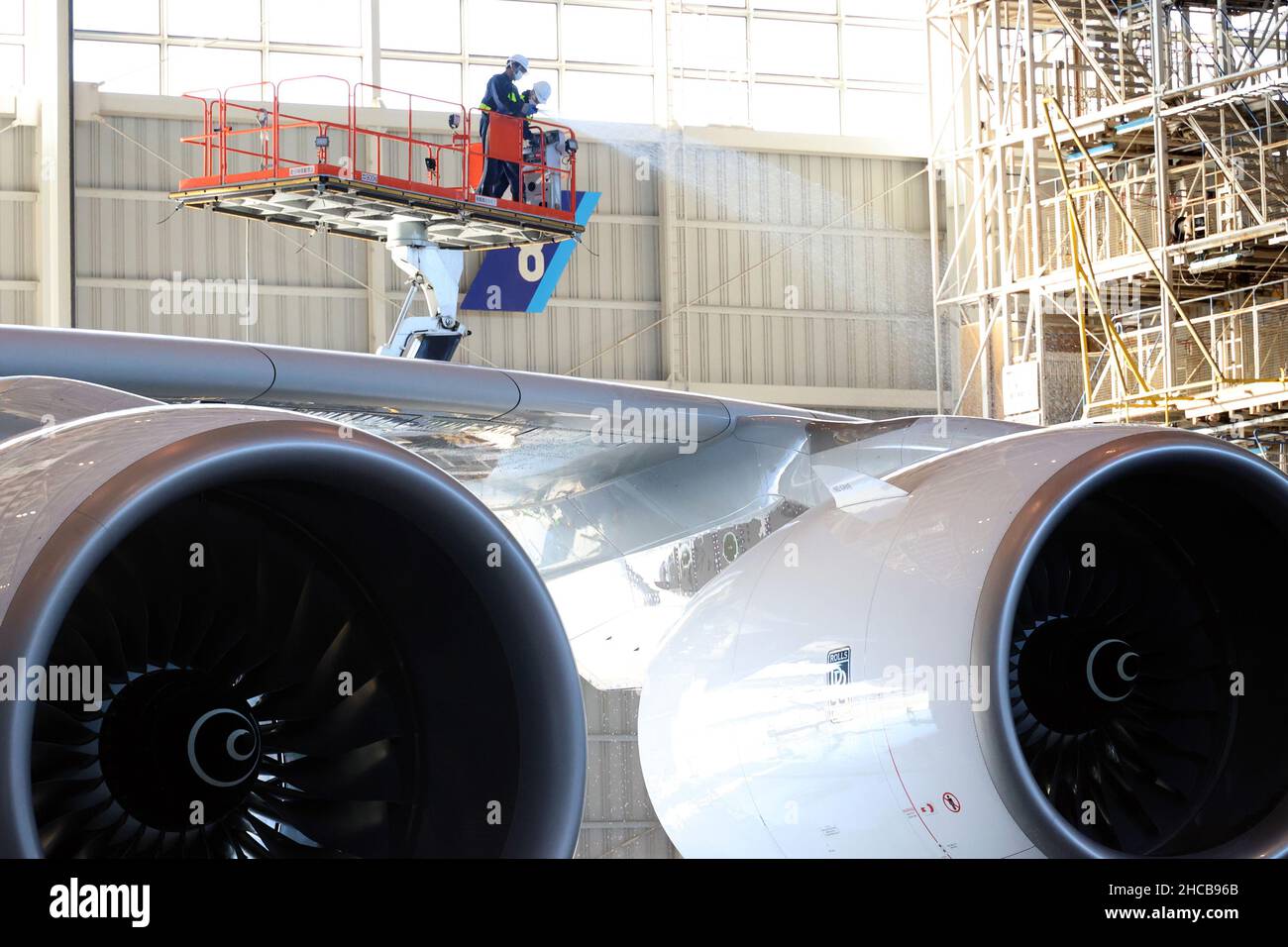 Narita, Japan. 27th Dec, 2021. Workers wash the world's largest ...