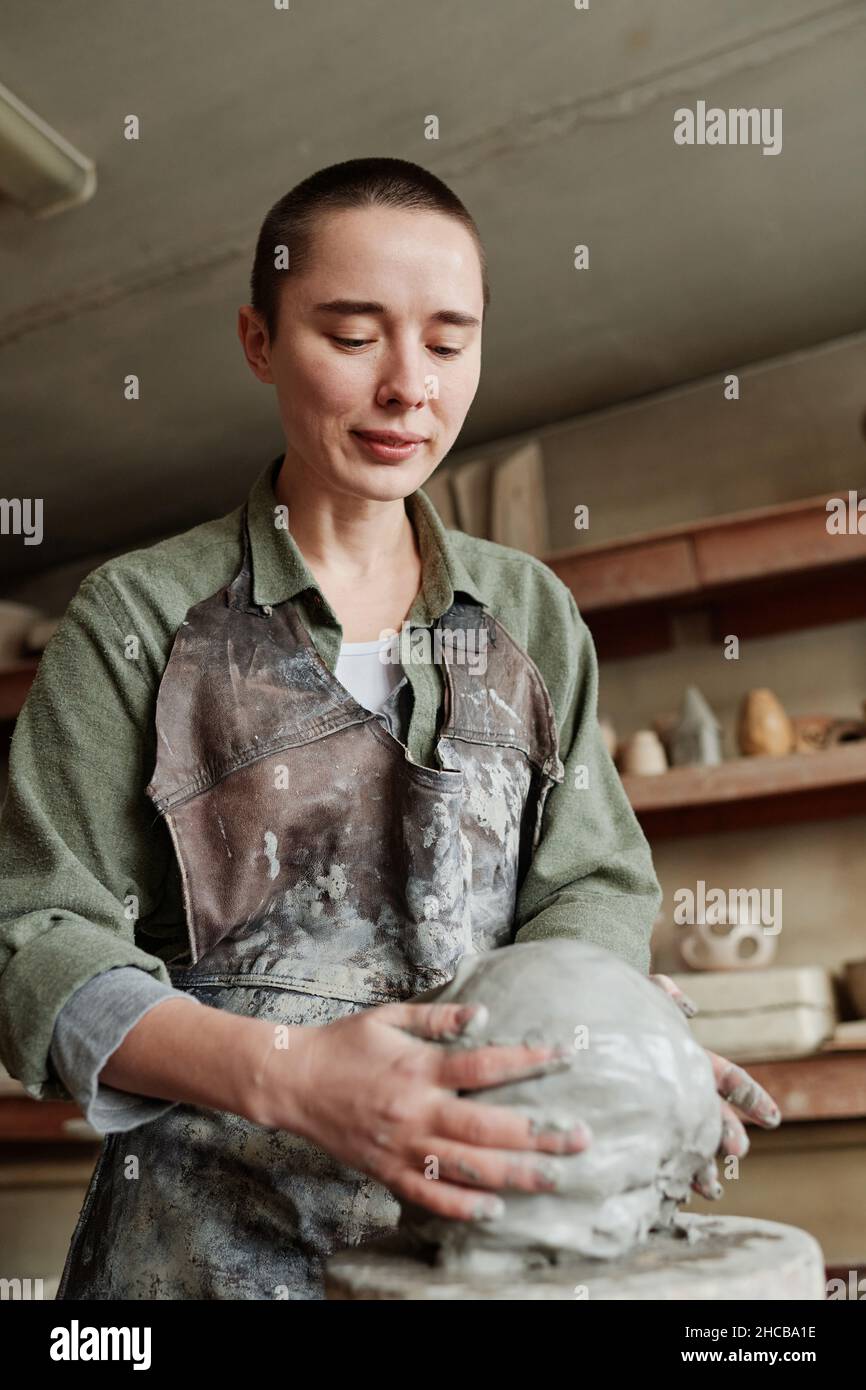 Woman creating clay sculpture hi-res stock photography and images - Alamy