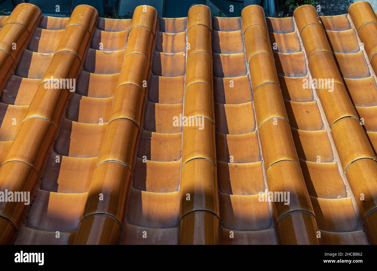 Overlapping rows of Orange ceramic roofing tiles texture covering ...