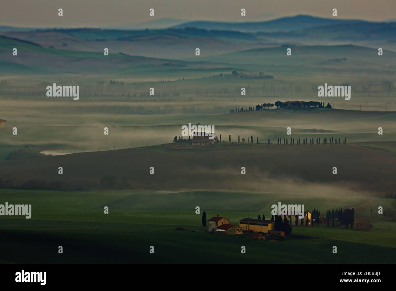 Landscape of houses on hills covered in greenery in the countryside in ...
