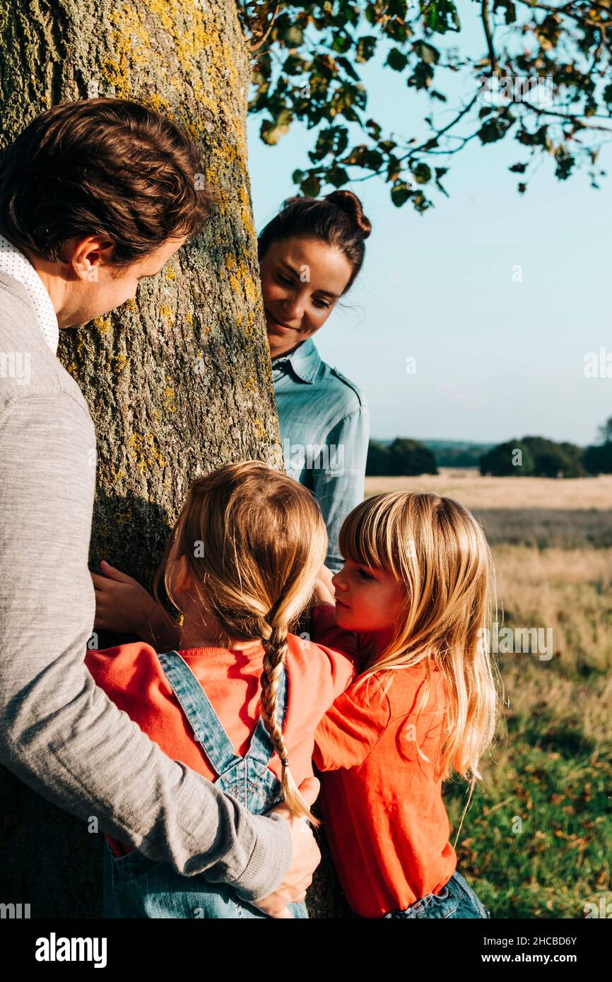 Group hugging tree hi-res stock photography and images - Alamy