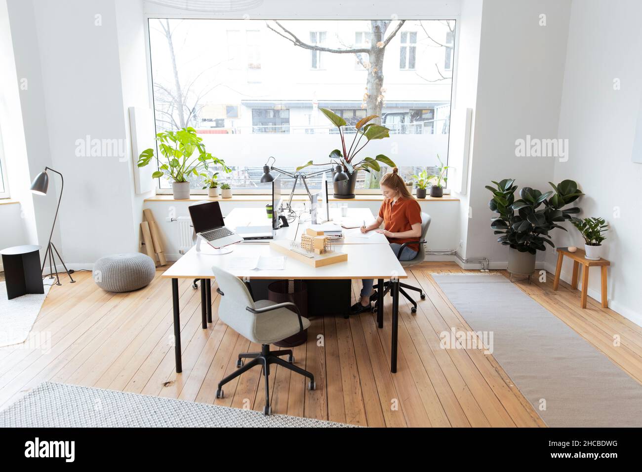 Laptop and computer on office desk Stock Photo - Alamy