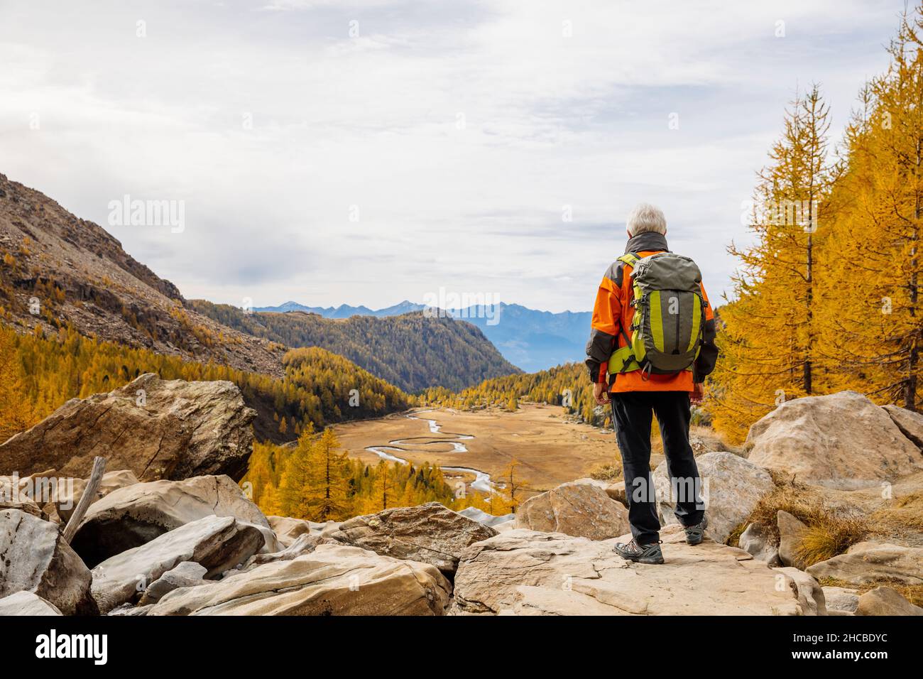 Backpacker standing rock rhaetian alps hi-res stock photography and ...