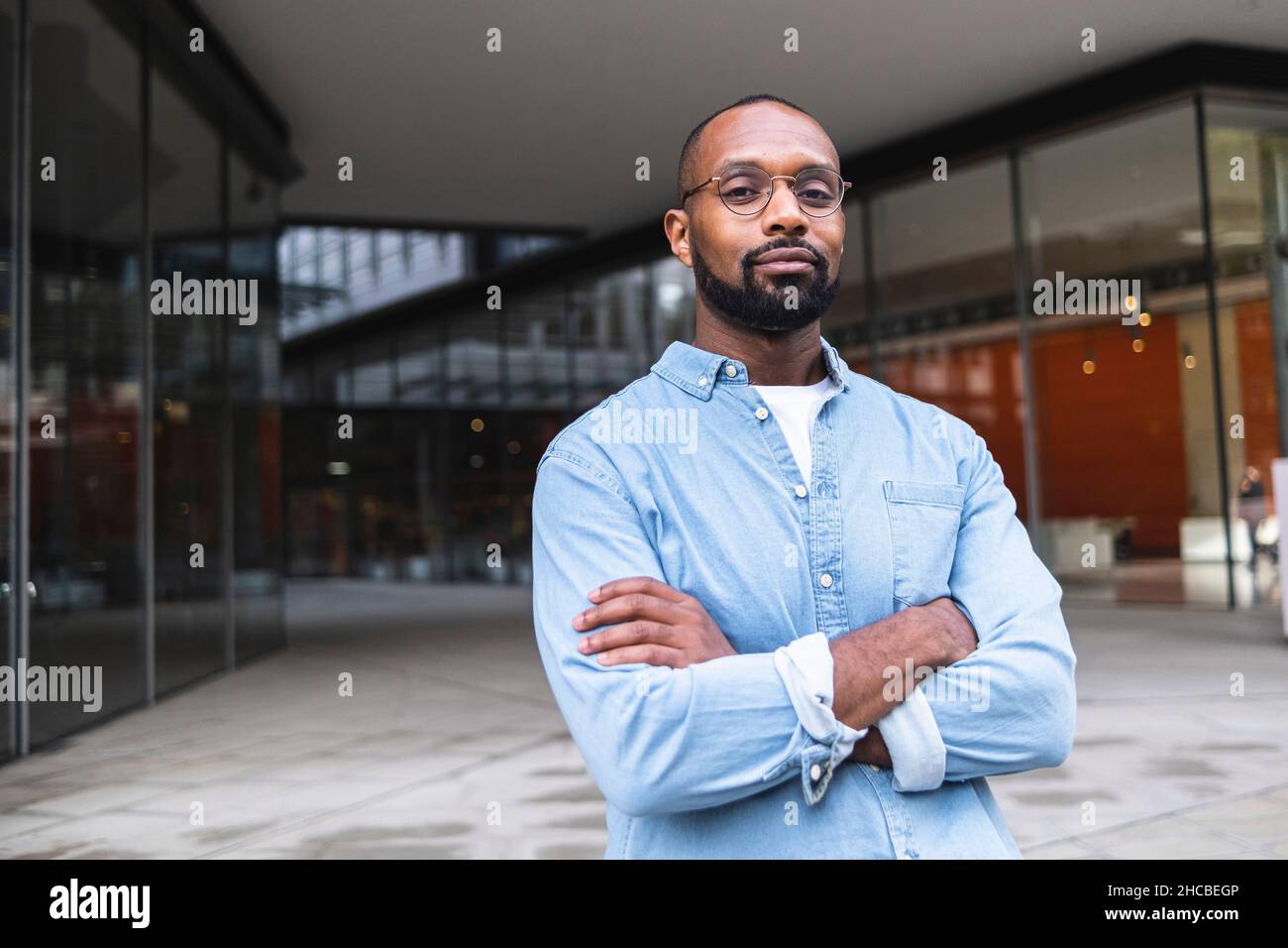 Man standing near buildings hi-res stock photography and images - Alamy