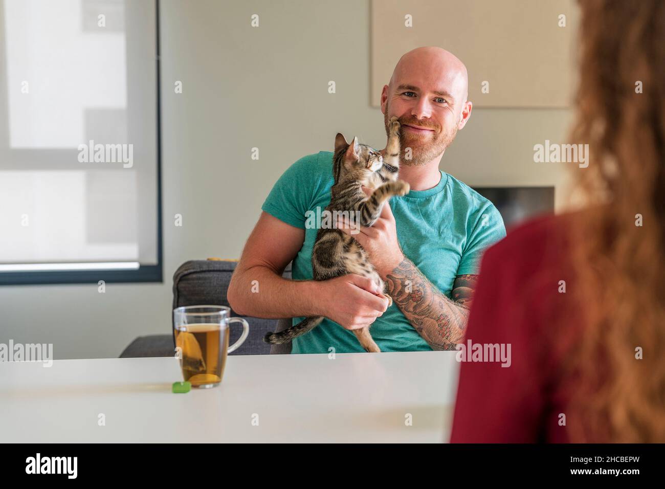 Man holding cat hi-res stock photography and images - Alamy