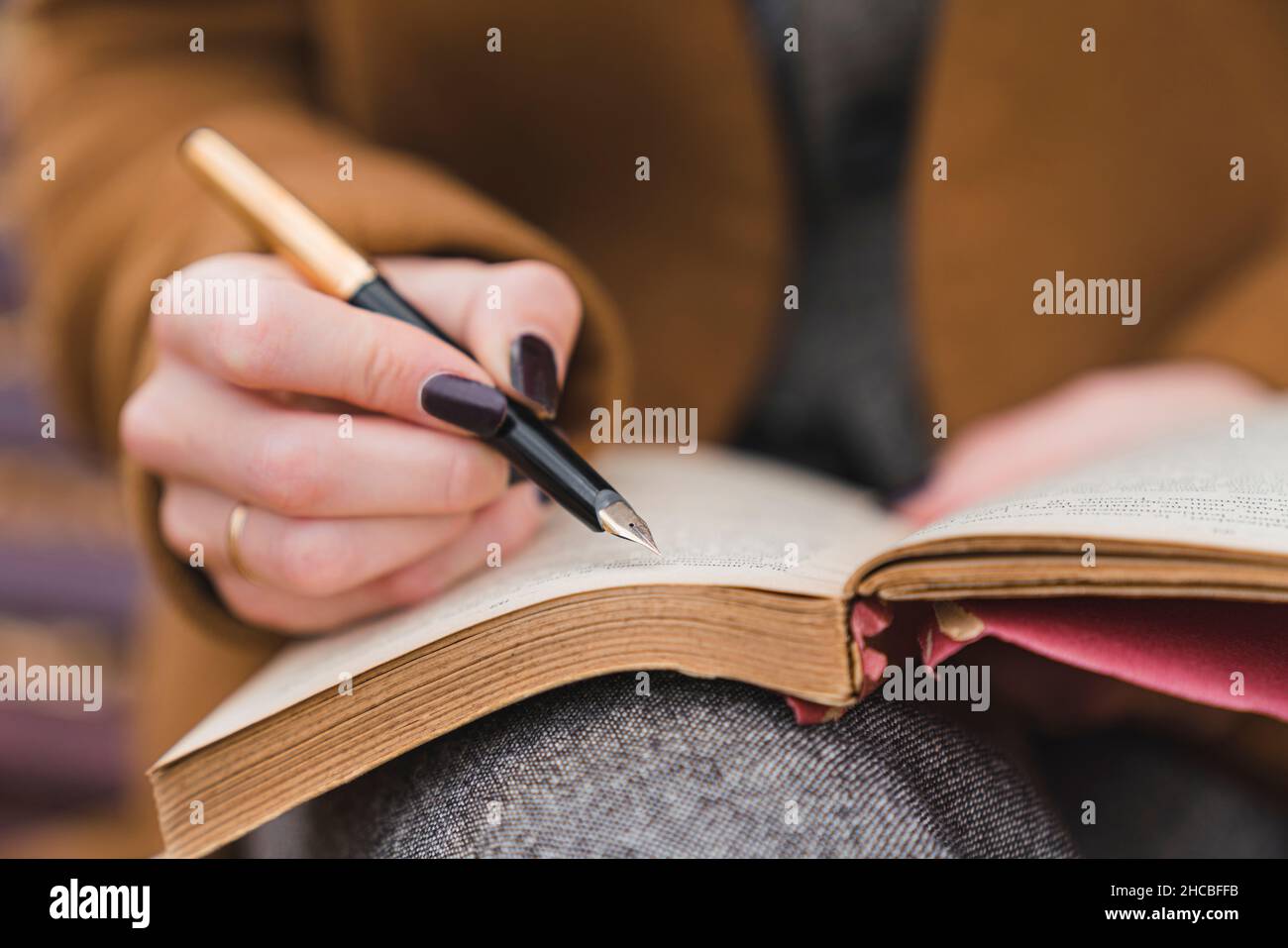 Woman writing with pen hi-res stock photography and images - Alamy