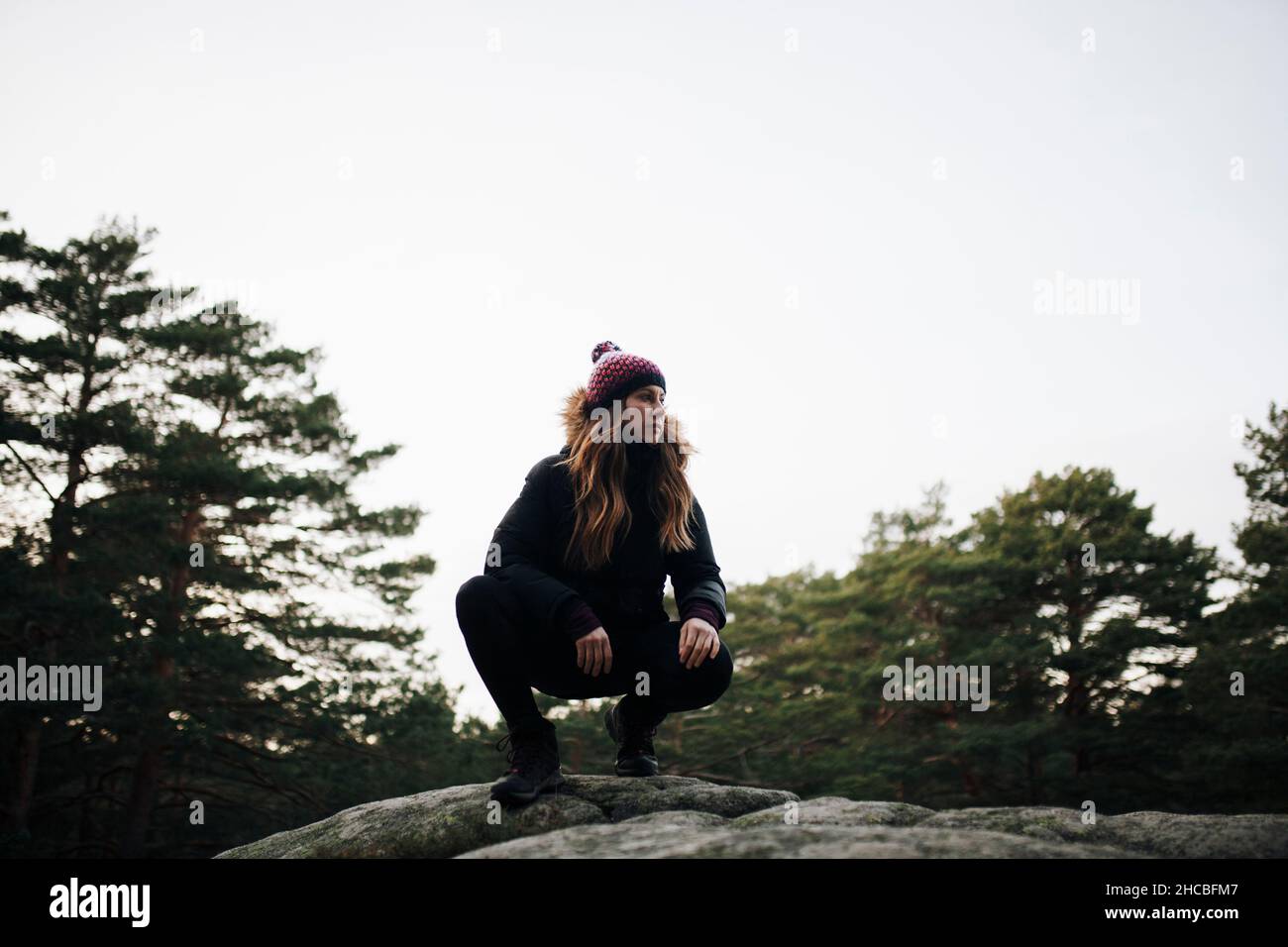 Crouching on rock hi-res stock photography and images - Alamy