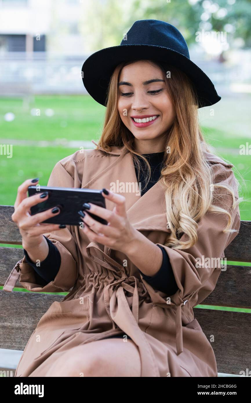 Female watching mobile hi-res stock photography and images - Alamy