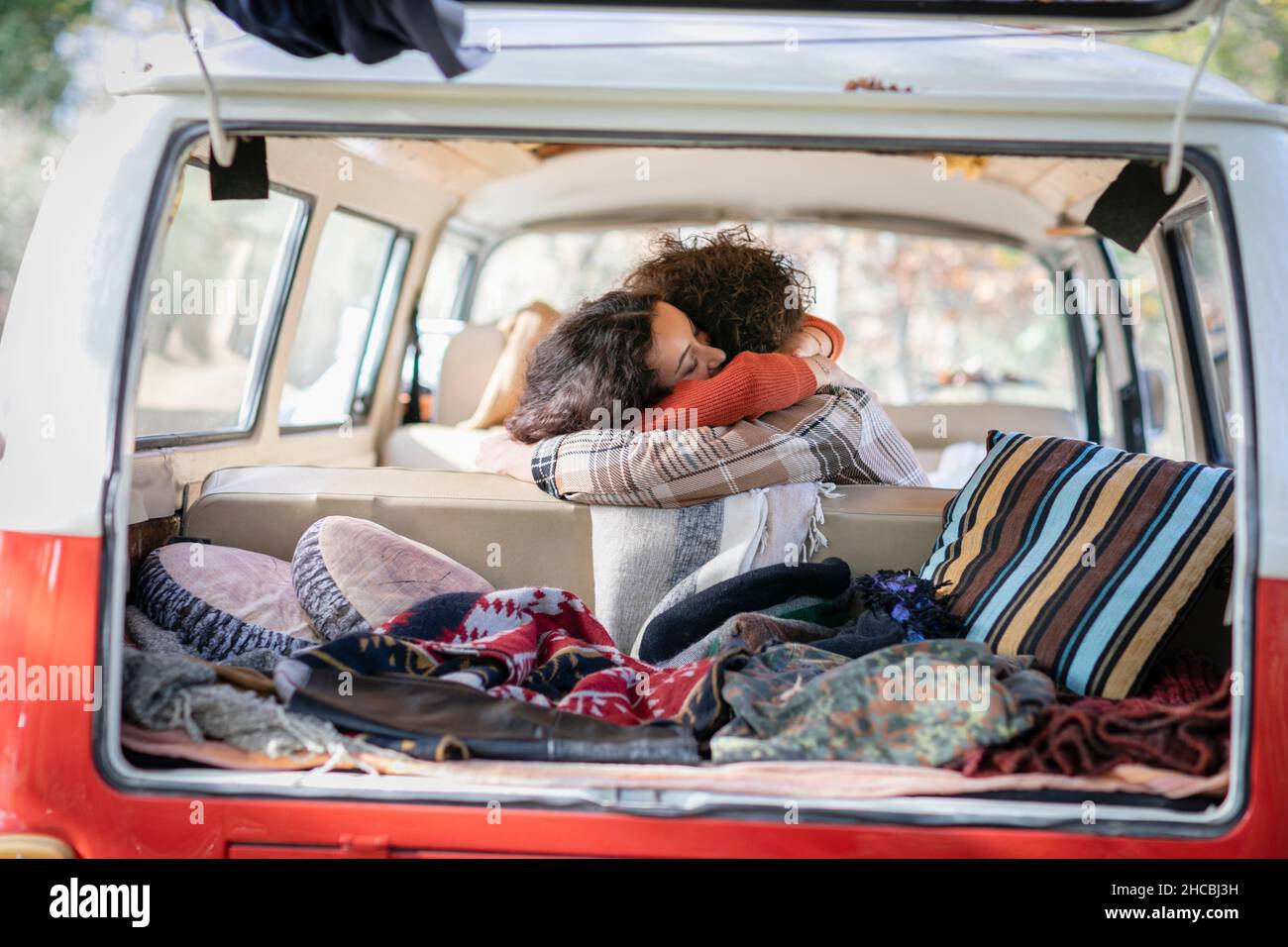 Couple hugging camper van hi-res stock photography and images - Alamy