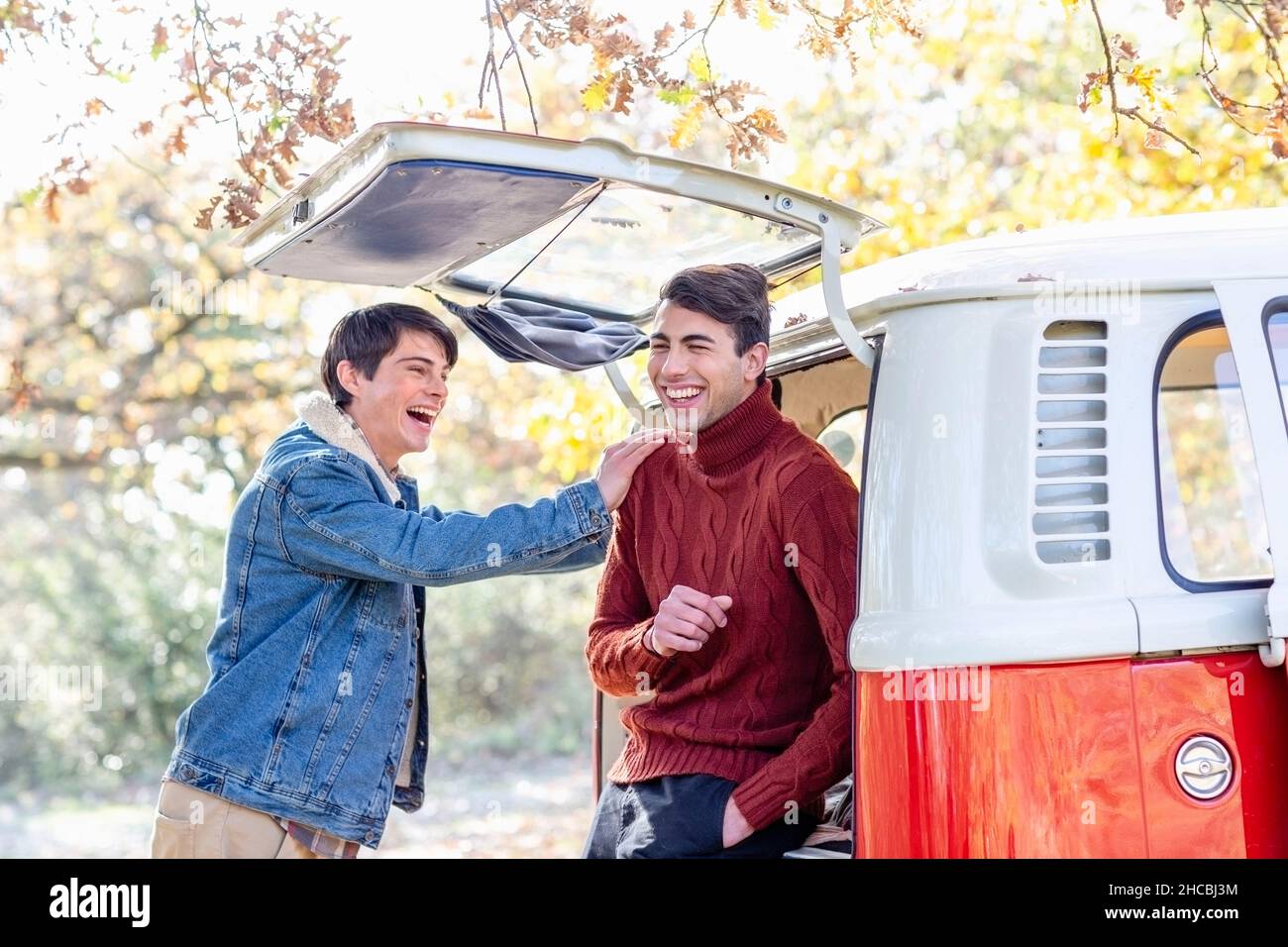 Three cheerful friends man two hi-res stock photography and images - Alamy
