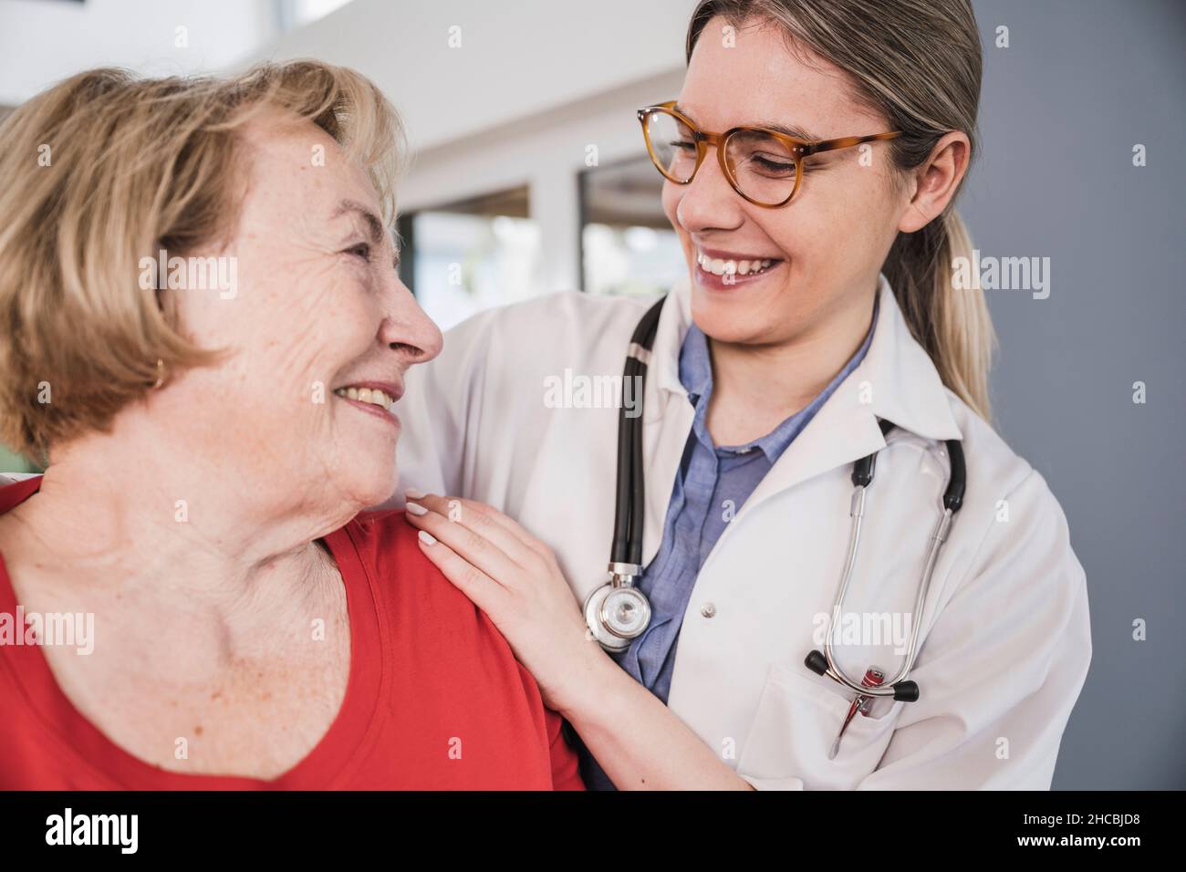 Doctor hand on shoulder hi-res stock photography and images - Alamy