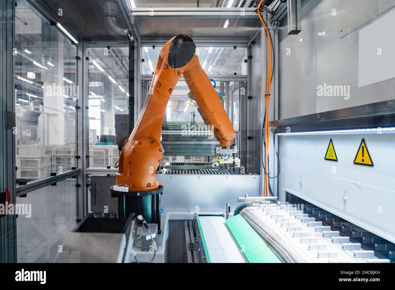 Robotic arm working at industry Stock Photo - Alamy