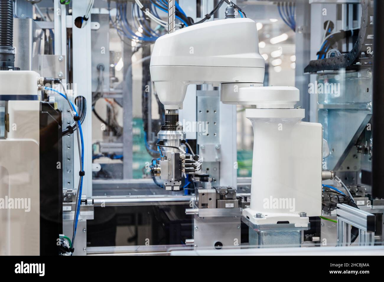 Robotic machine working in factory Stock Photo - Alamy