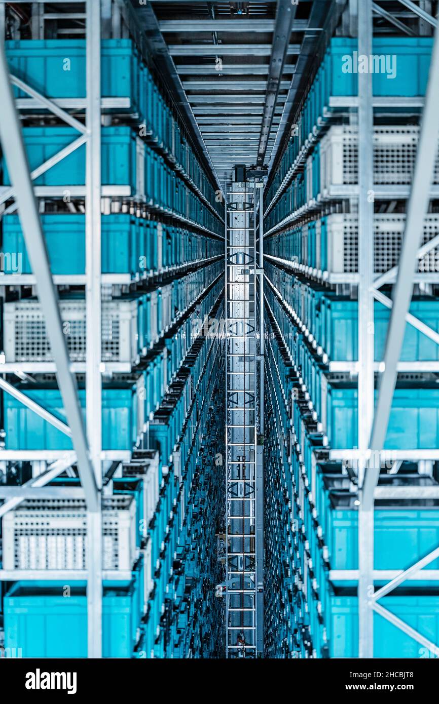 Blue containers in racks at modern factory Stock Photo - Alamy