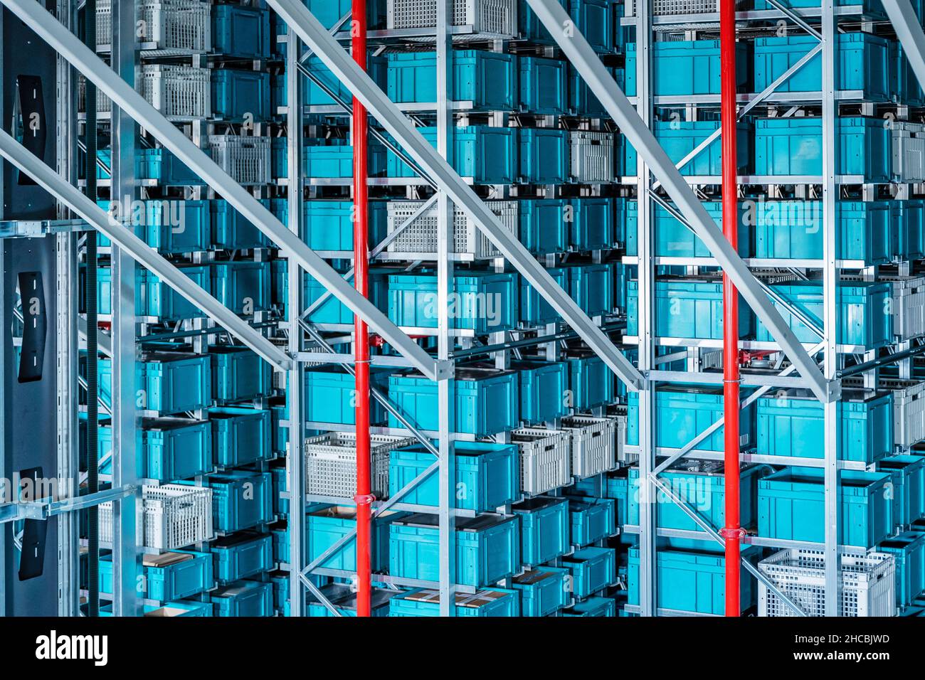 Blue containers in automatized high rack at warehouse Stock Photo - Alamy