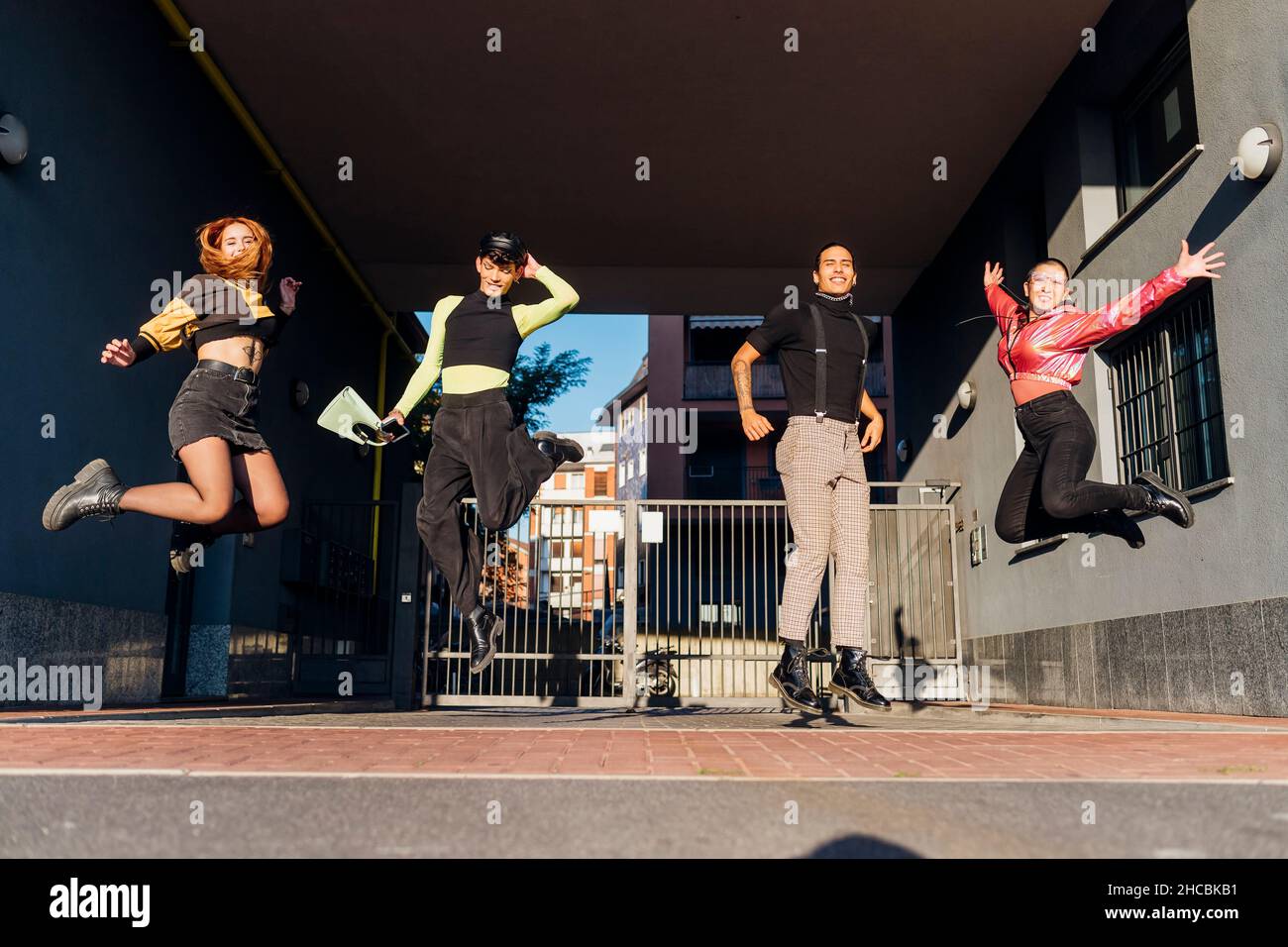 Happy group friends jumping full hi-res stock photography and images ...