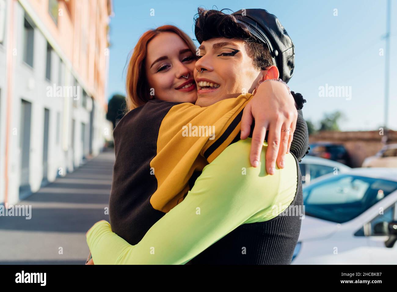 Male friends hugging hi-res stock photography and images - Alamy