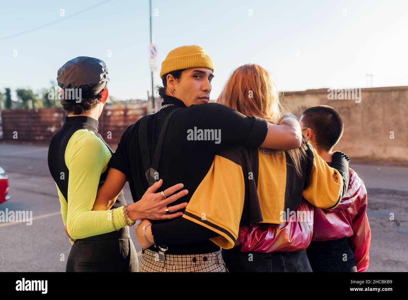 Arm around shoulder rear view hi-res stock photography and images - Alamy
