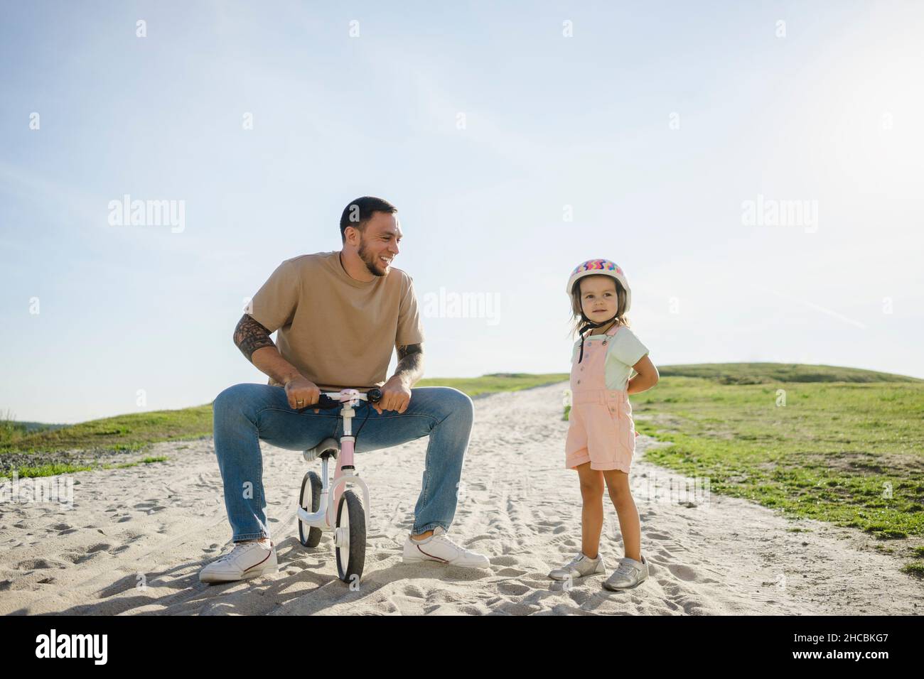 2 female and one male sitting and one person standing hi-res stock ...