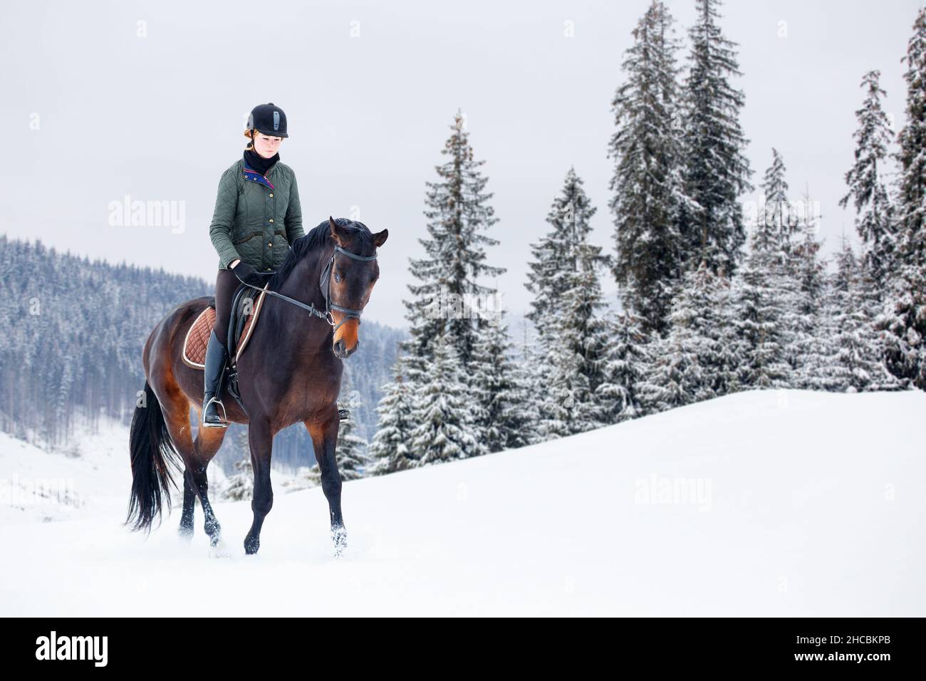 Young female in snowy mountains hi-res stock photography and images - Alamy