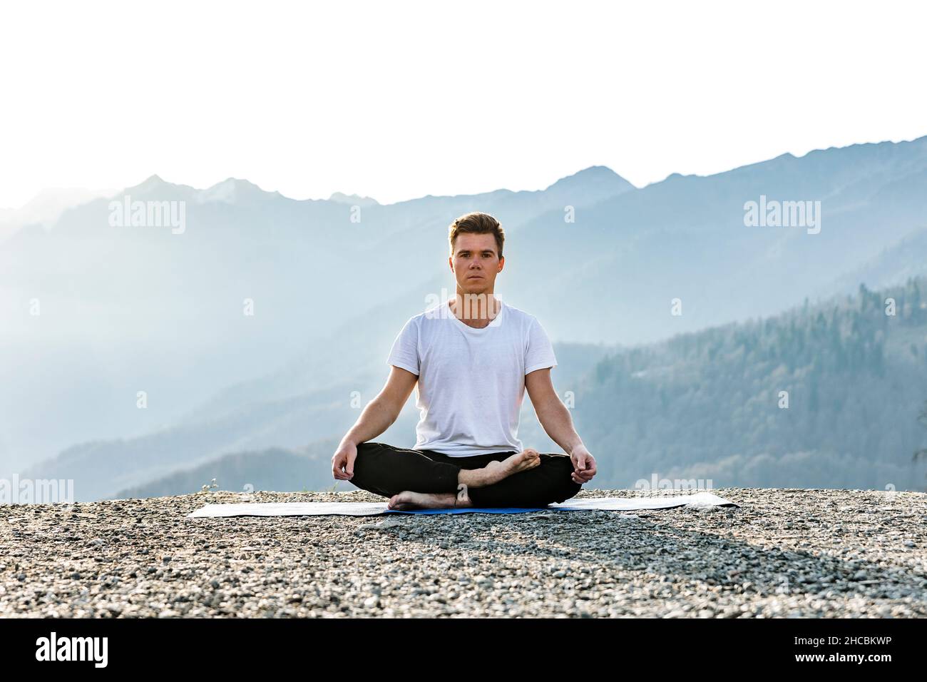 Man sitting lotus position hi-res stock photography and images - Alamy