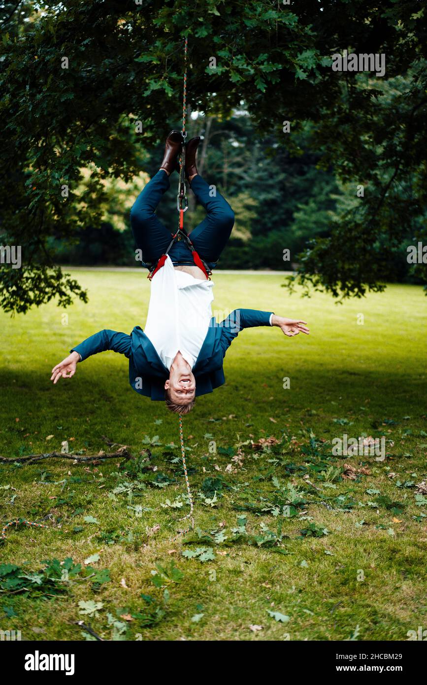 Man hanging upside down on hi-res stock photography and images - Alamy