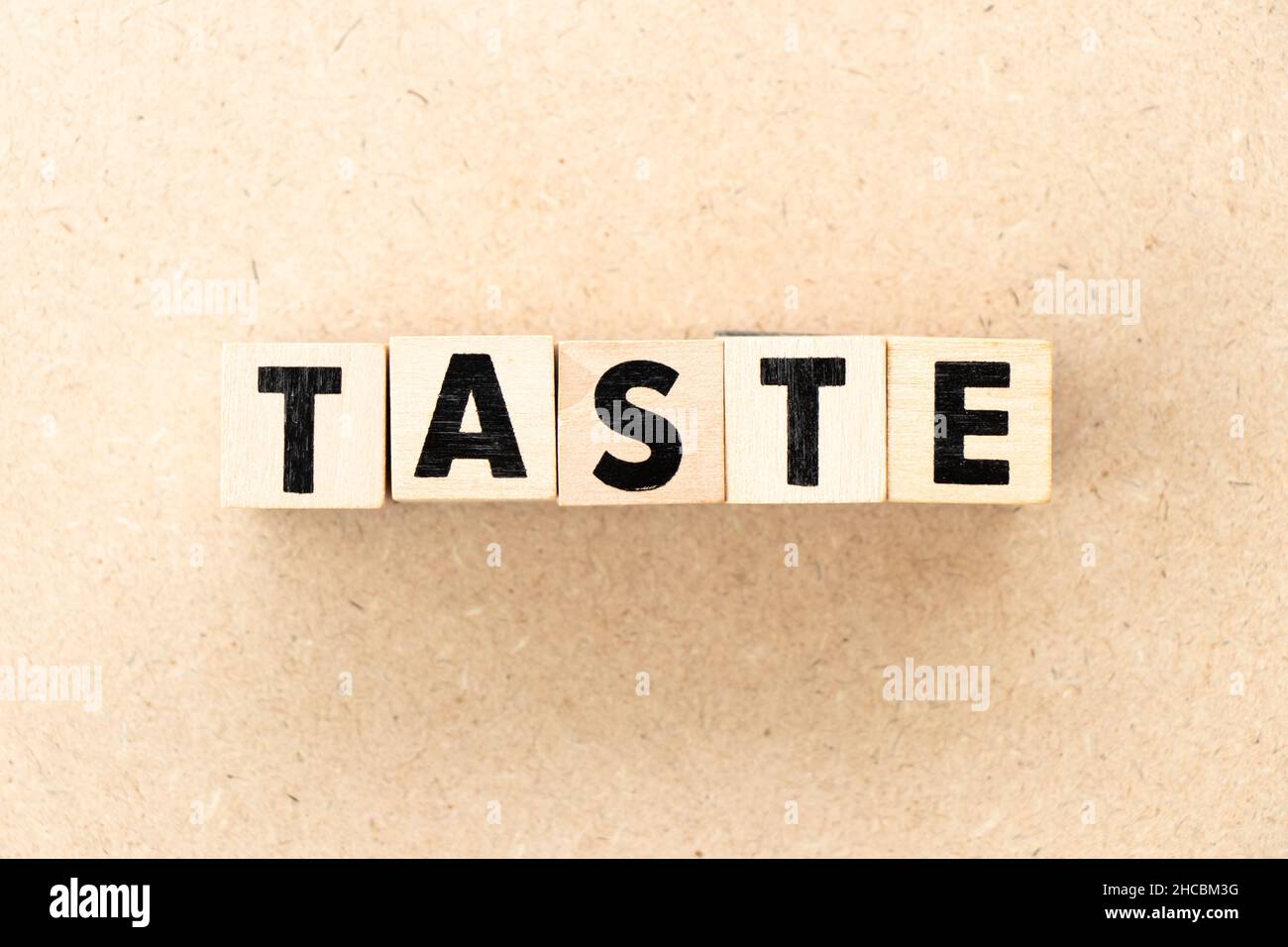 Alphabet letter block in word taste on wood background Stock Photo - Alamy