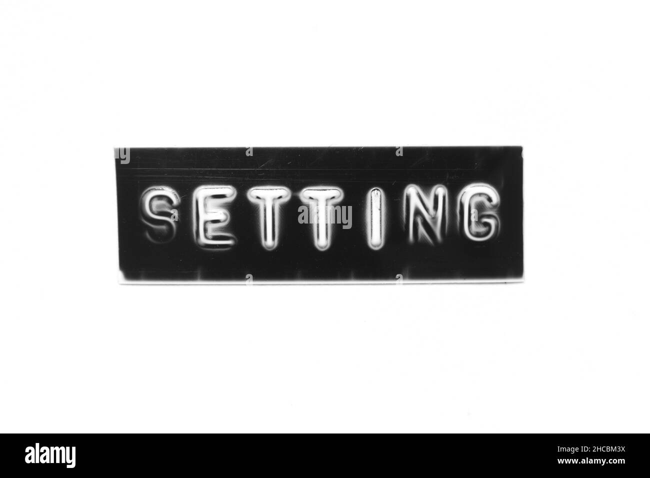 Black color banner that have embossed letter with word setting on white ...