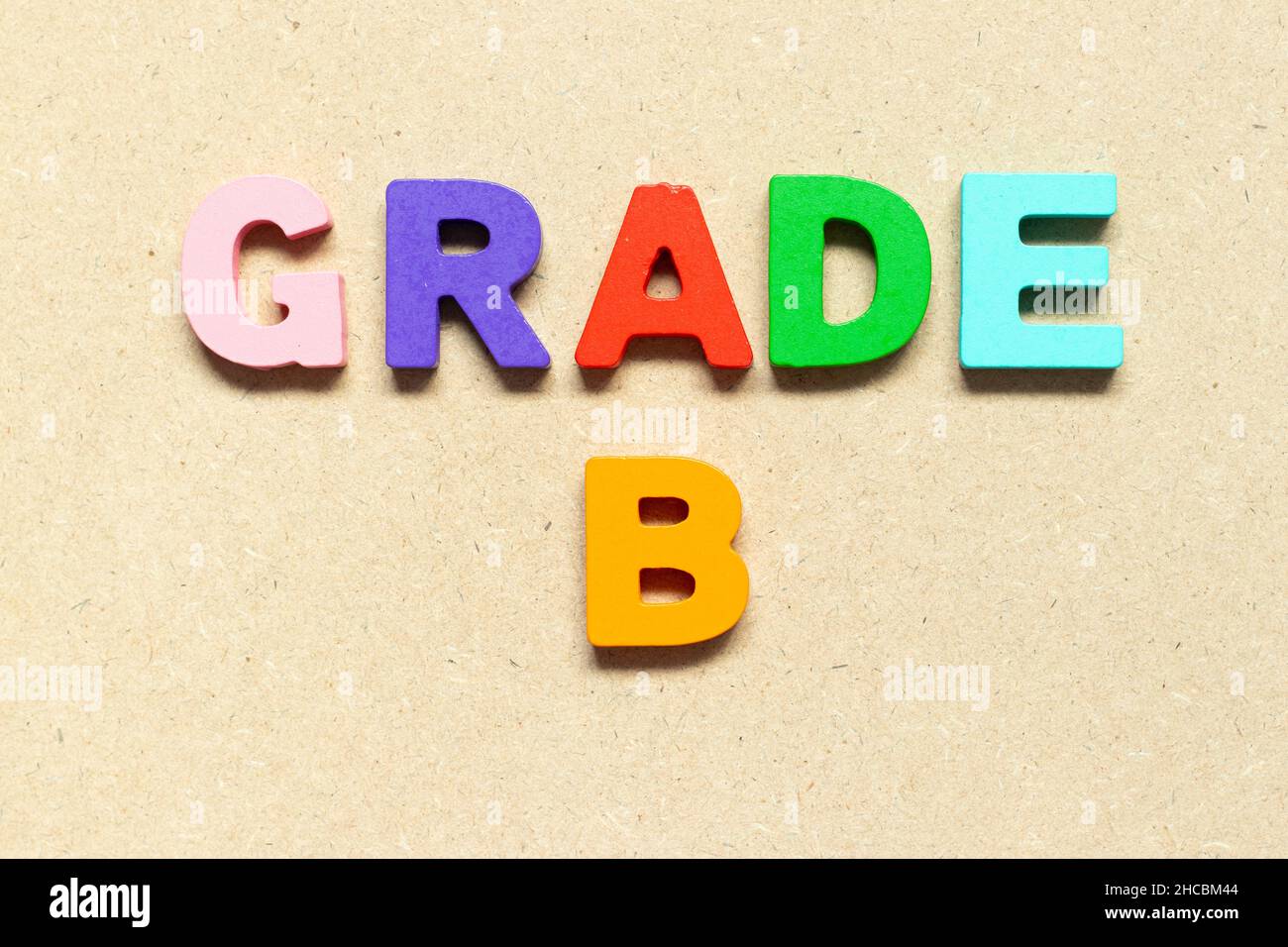 Color alphabet letter with word grade B on wood background Stock Photo ...
