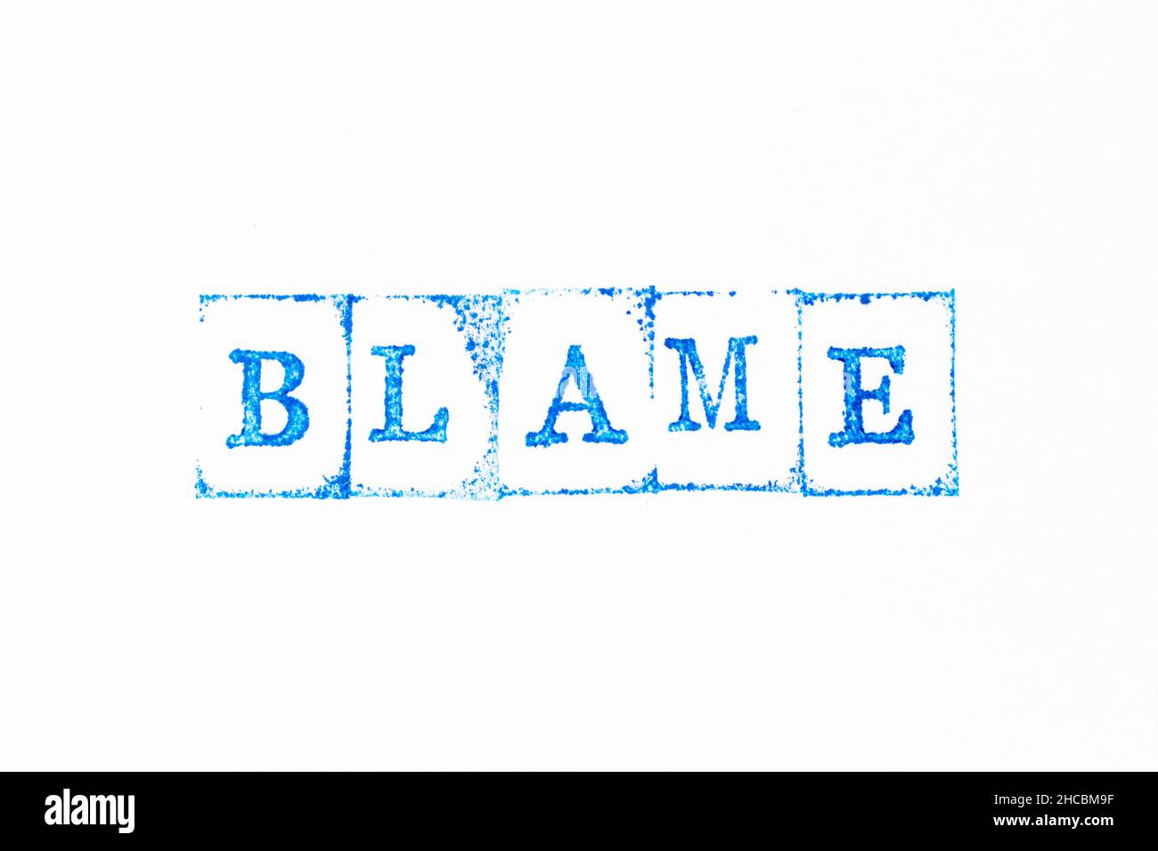 Blue color ink rubber stamp in word blame on white paper background ...