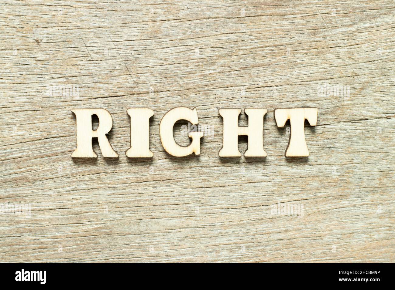 Alphabet letter in word right on wood background Stock Photo - Alamy