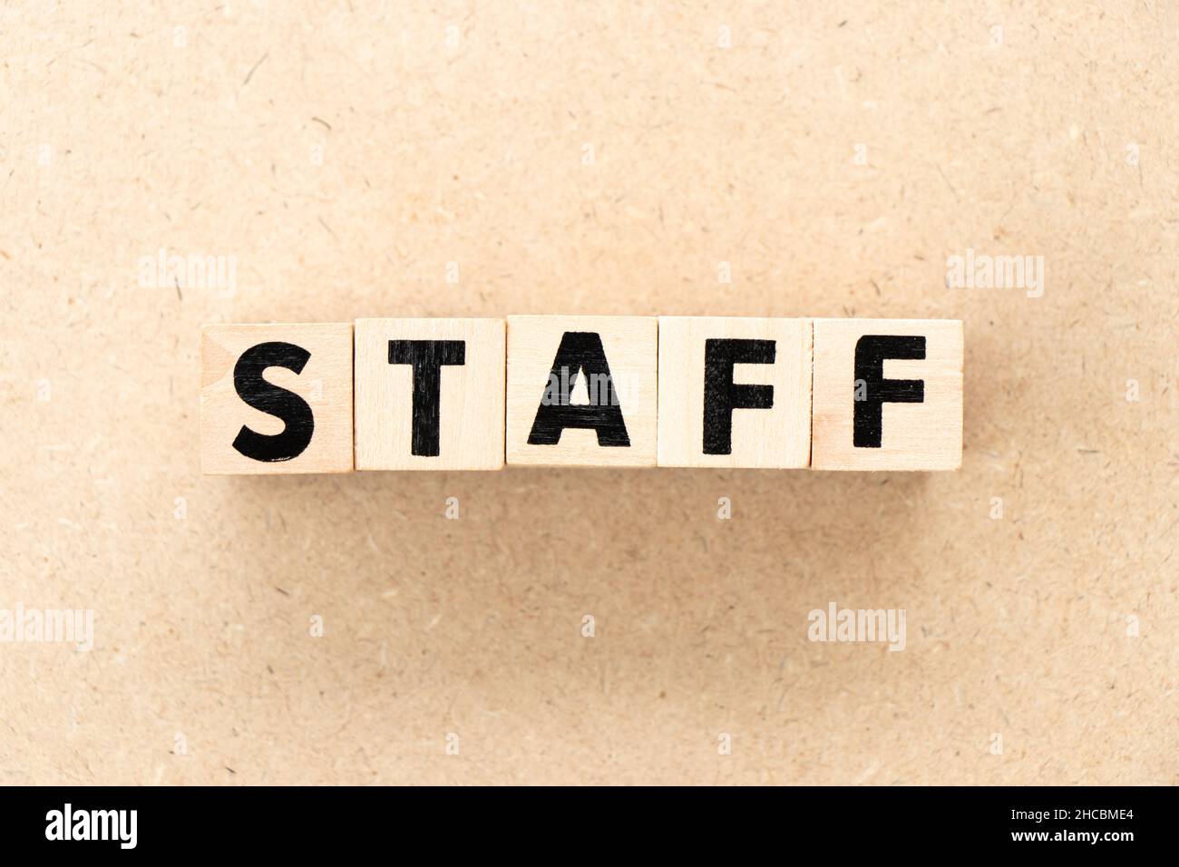 Alphabet letter block in word staff on wood background Stock Photo - Alamy