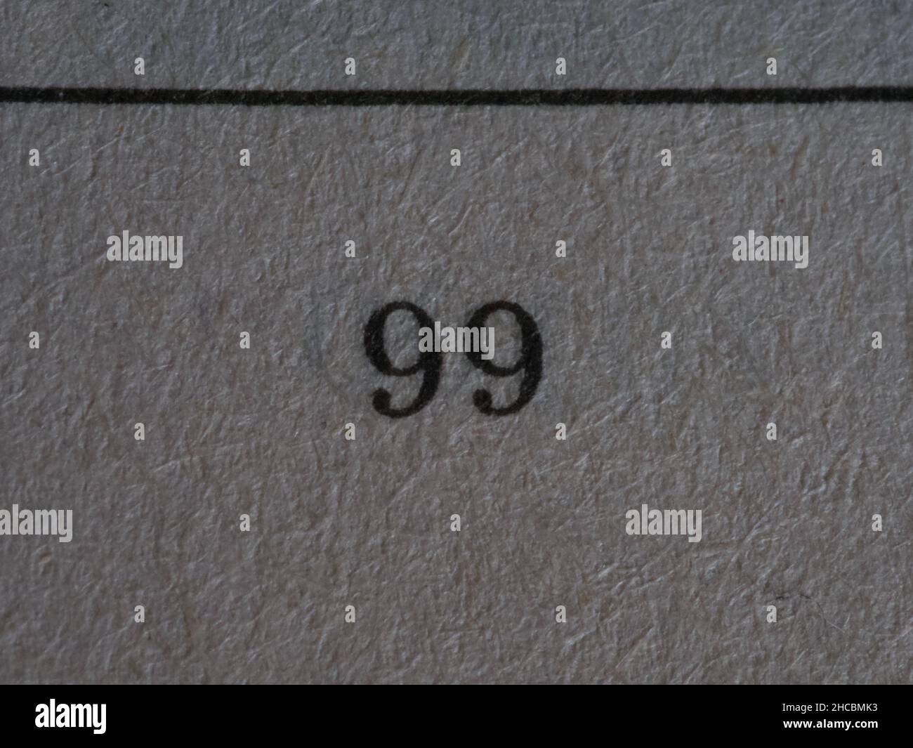 The number 99 printed on a piece of paper. Paper texture Stock Photo ...