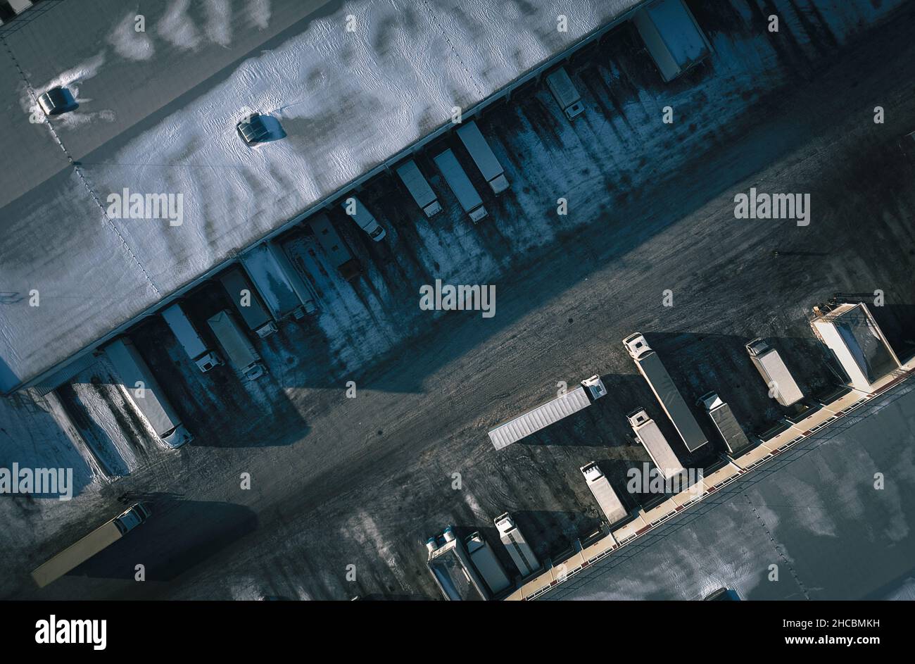 Loading Dock Industrial Warehouse with Many Truck with and Trailers are ...