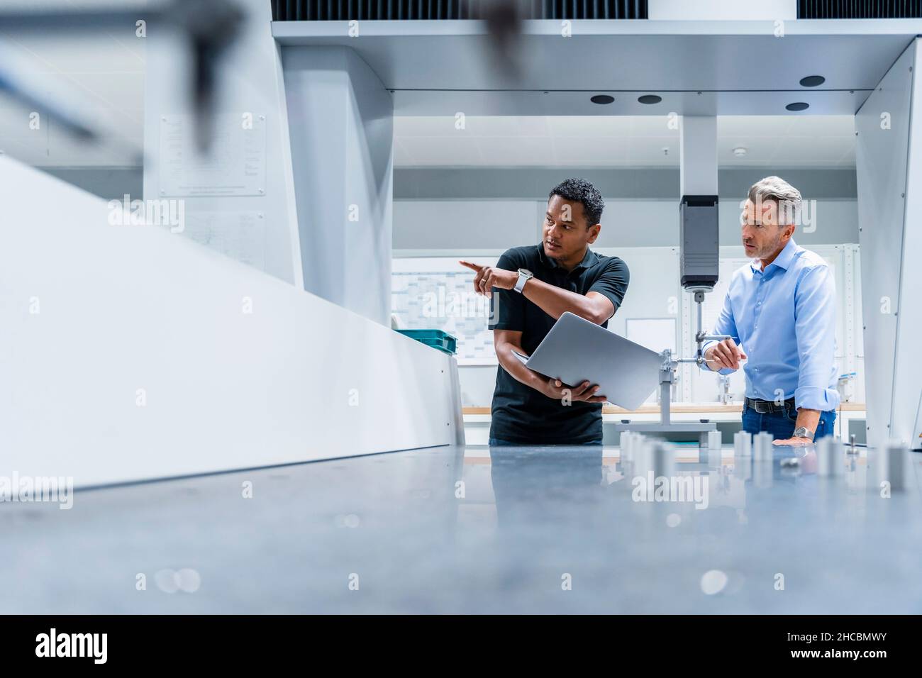 Businessman pointing modern building hi-res stock photography and ...