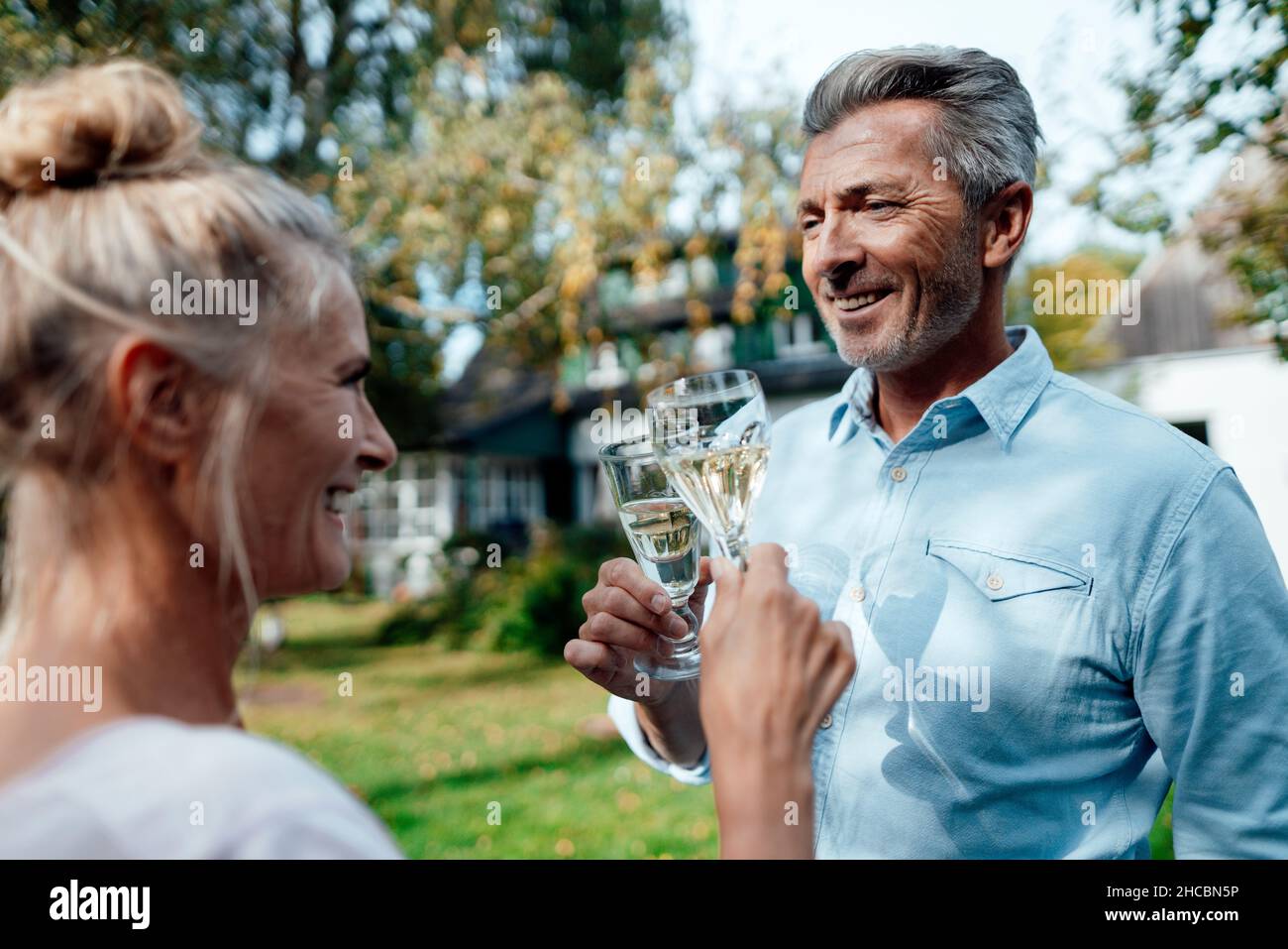 Man looking through house window Stock Photo - Alamy
